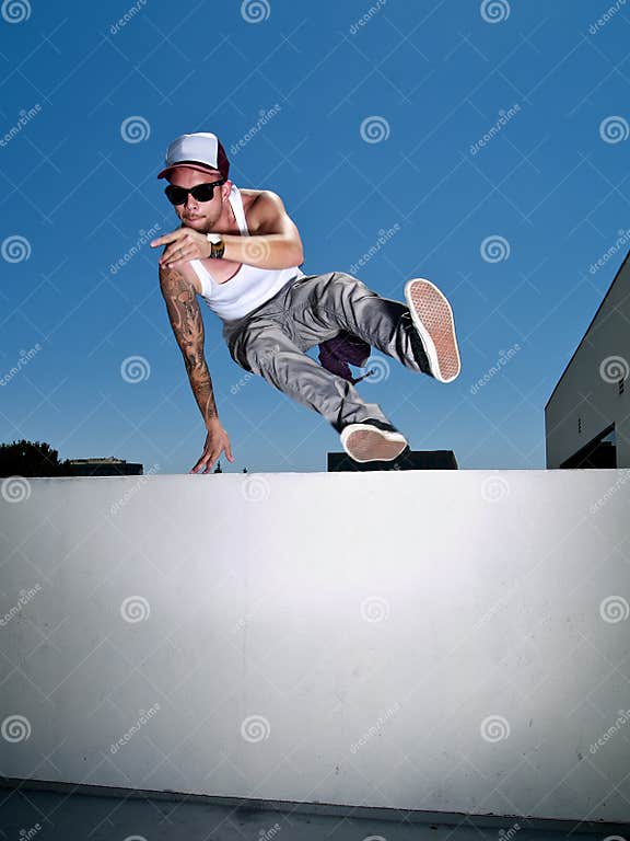 Jumping over a wall stock image. Image of parkour, freerunner - 20240017