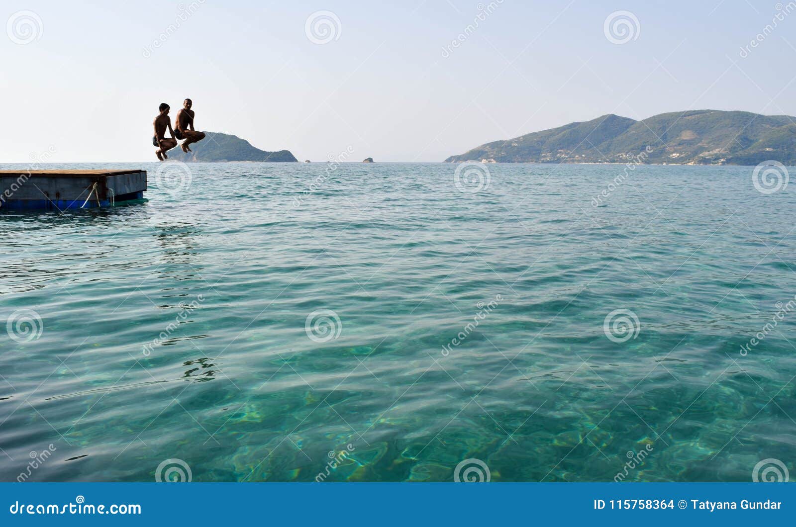 Jumping into the Sea from the Pontoon. Stock Photo - Image of pontoon ...
