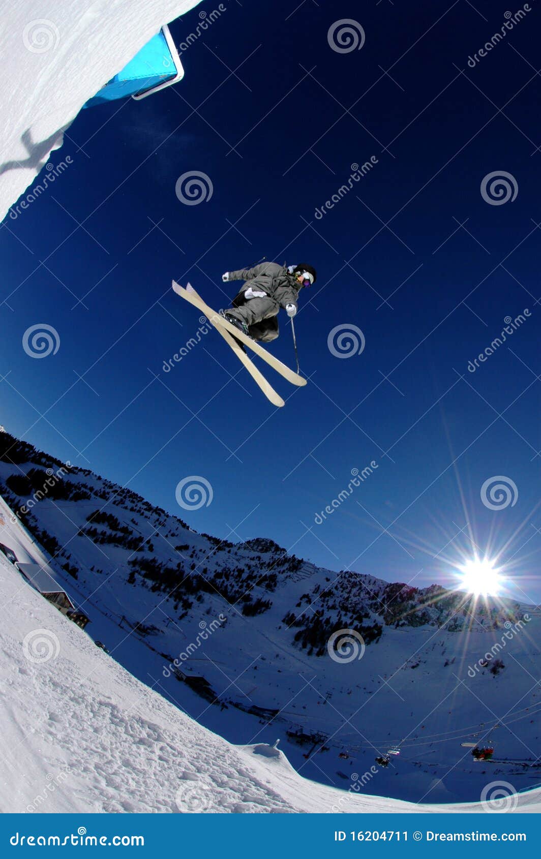 Jumping Skier in the Sun on Blue Sky Stock Image - Image of blue ...