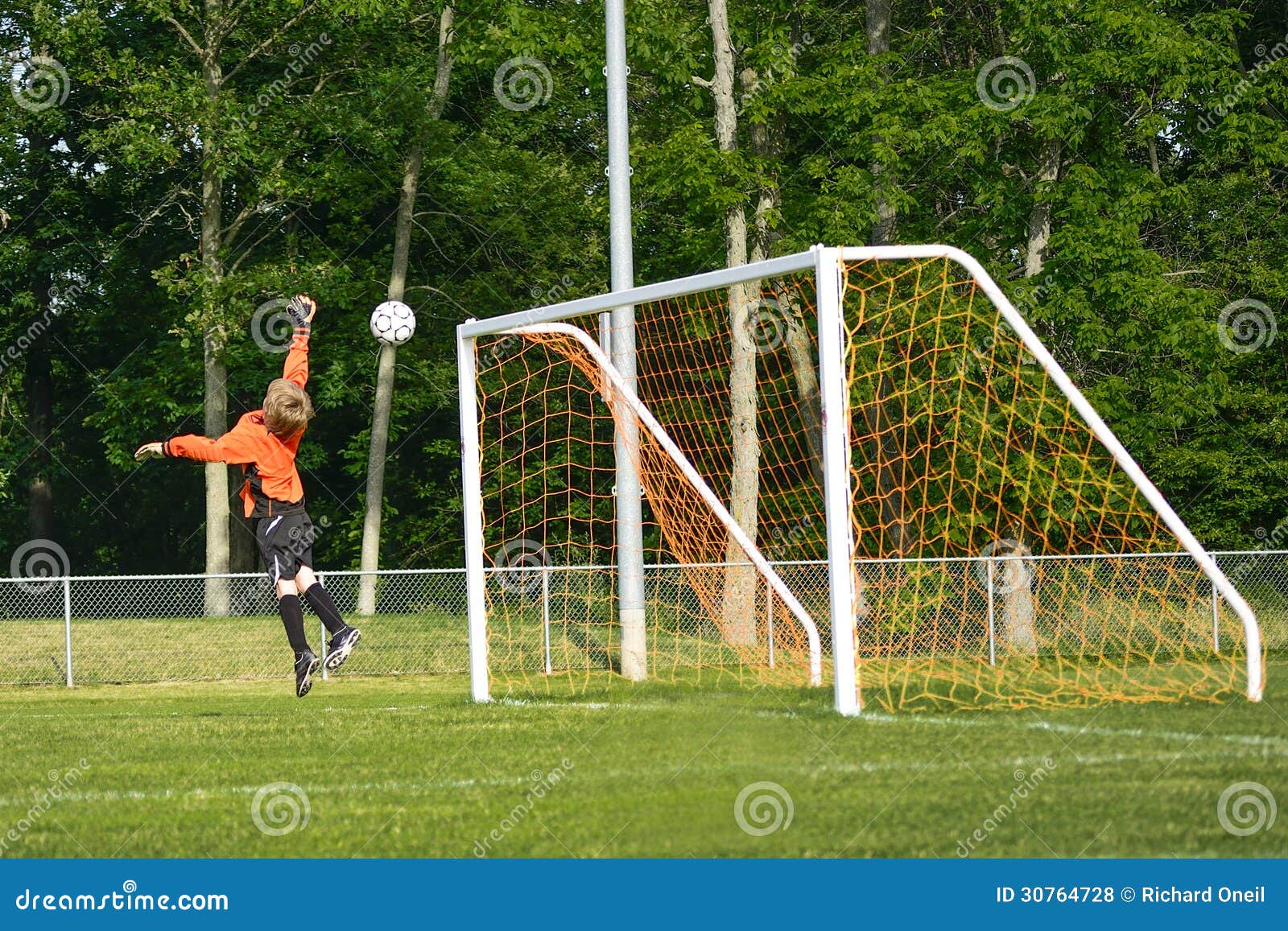Jumping soccer goalie stock photo. Image of shorts, soccer - 30764728