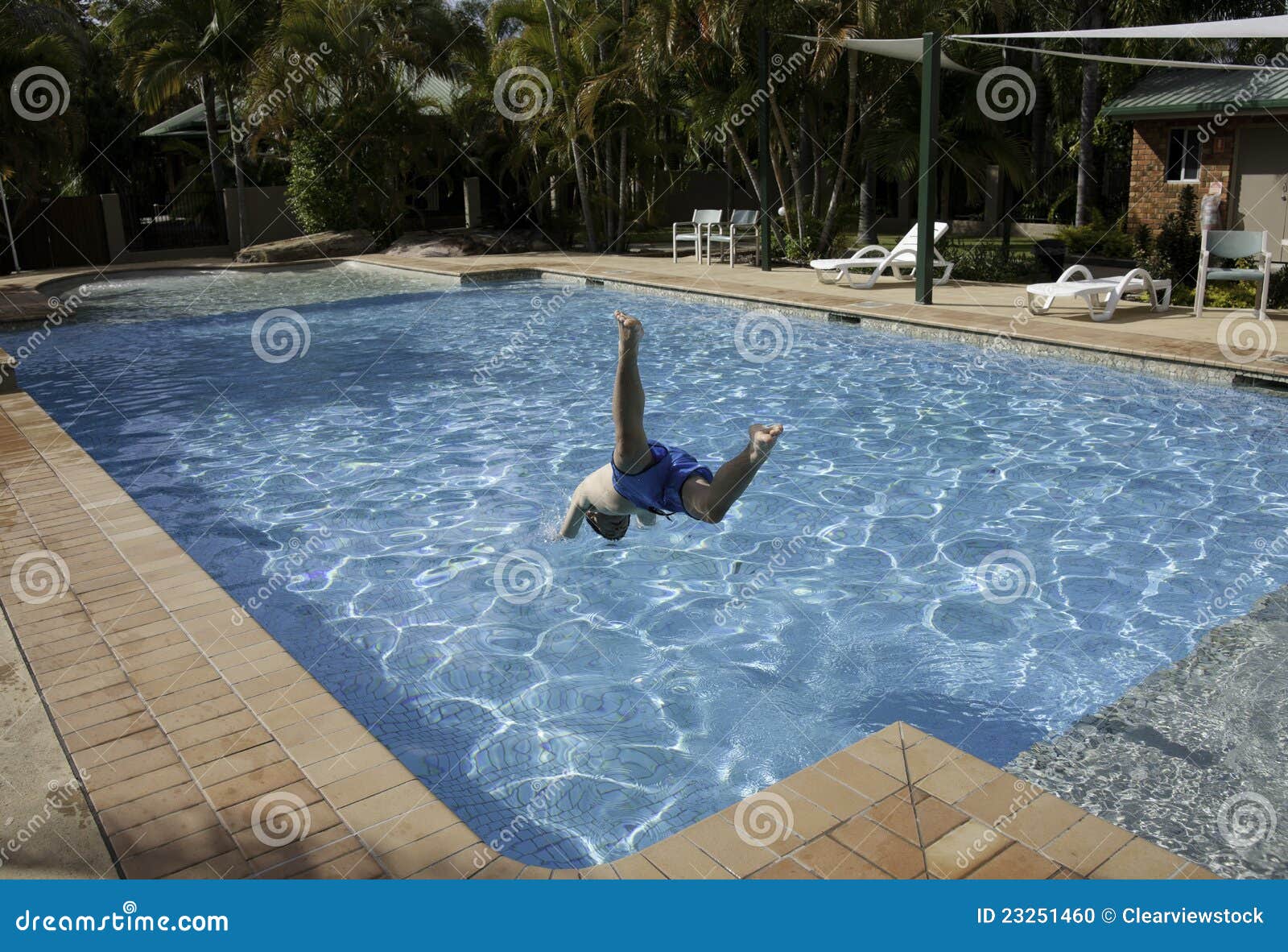 Jumping into swimming pool stock photo. Image of jumping - 23251460