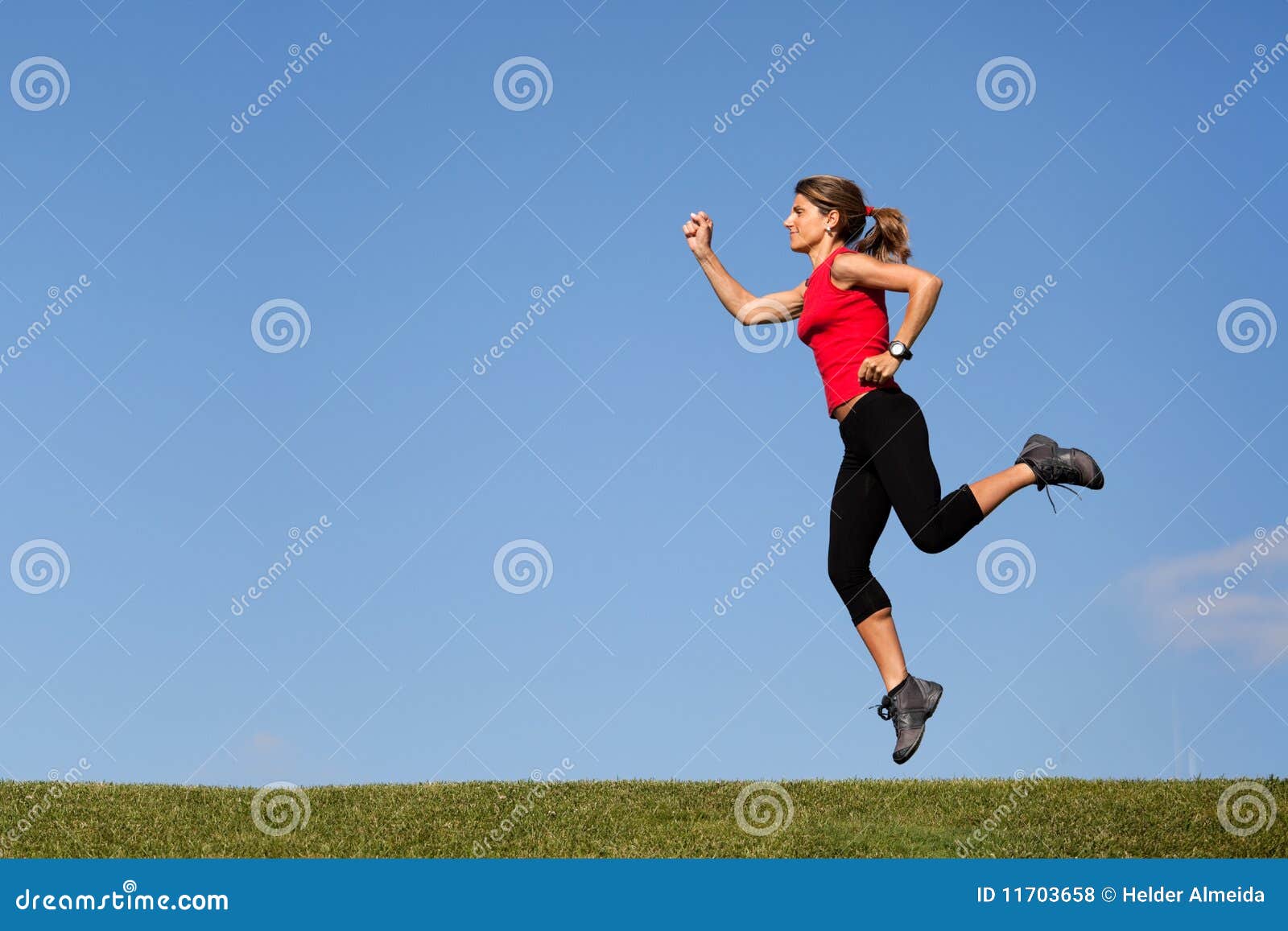 Jumping at the Top of the Hill Stock Photo - Image of achivement ...