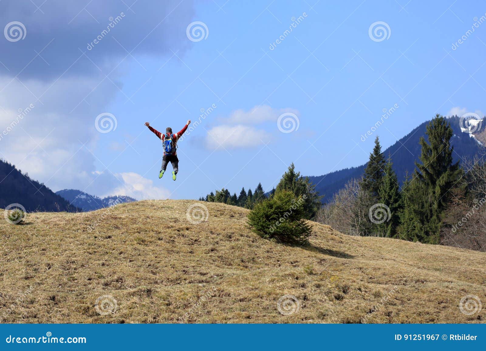 Jumping Up in Front of the Mountains Stock Image - Image of explore ...