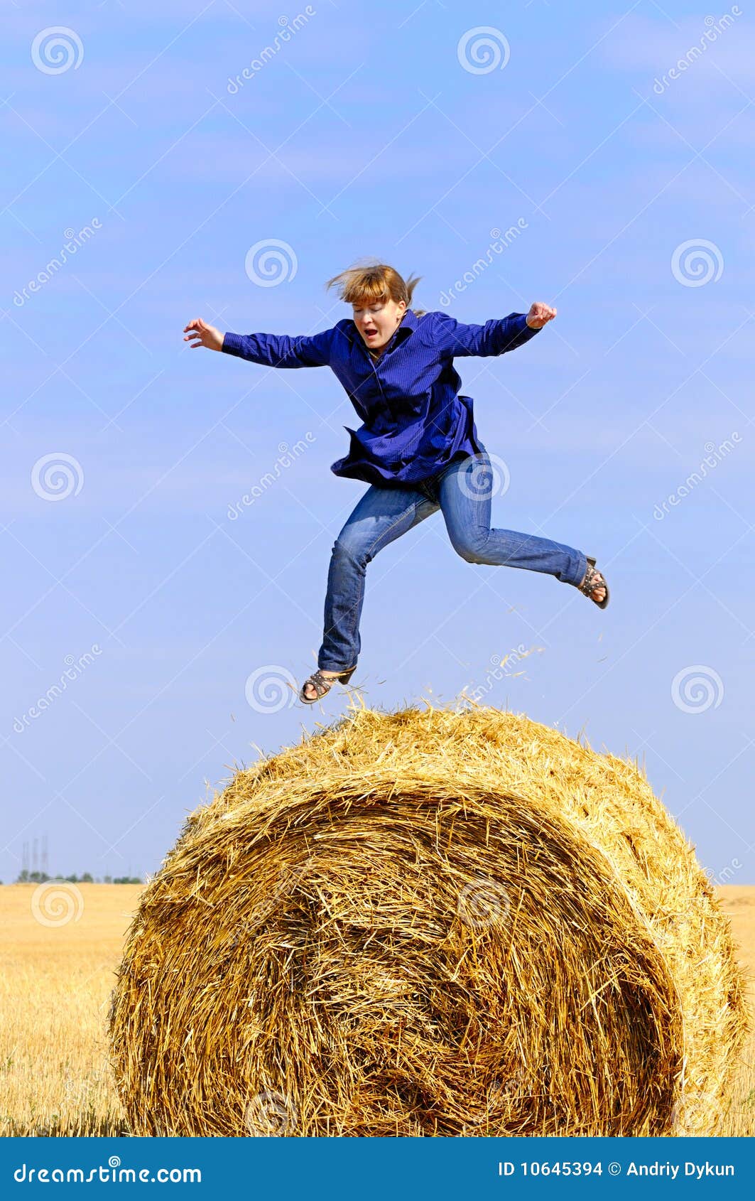 Jumping up on straw roll stock photo. Image of people - 10645394