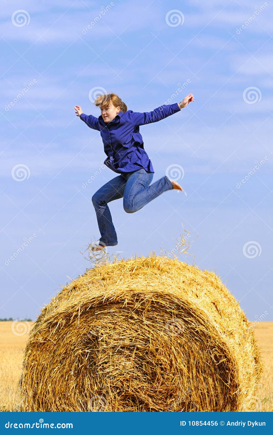 Jumping up on straw roll stock photo. Image of empty - 10854456