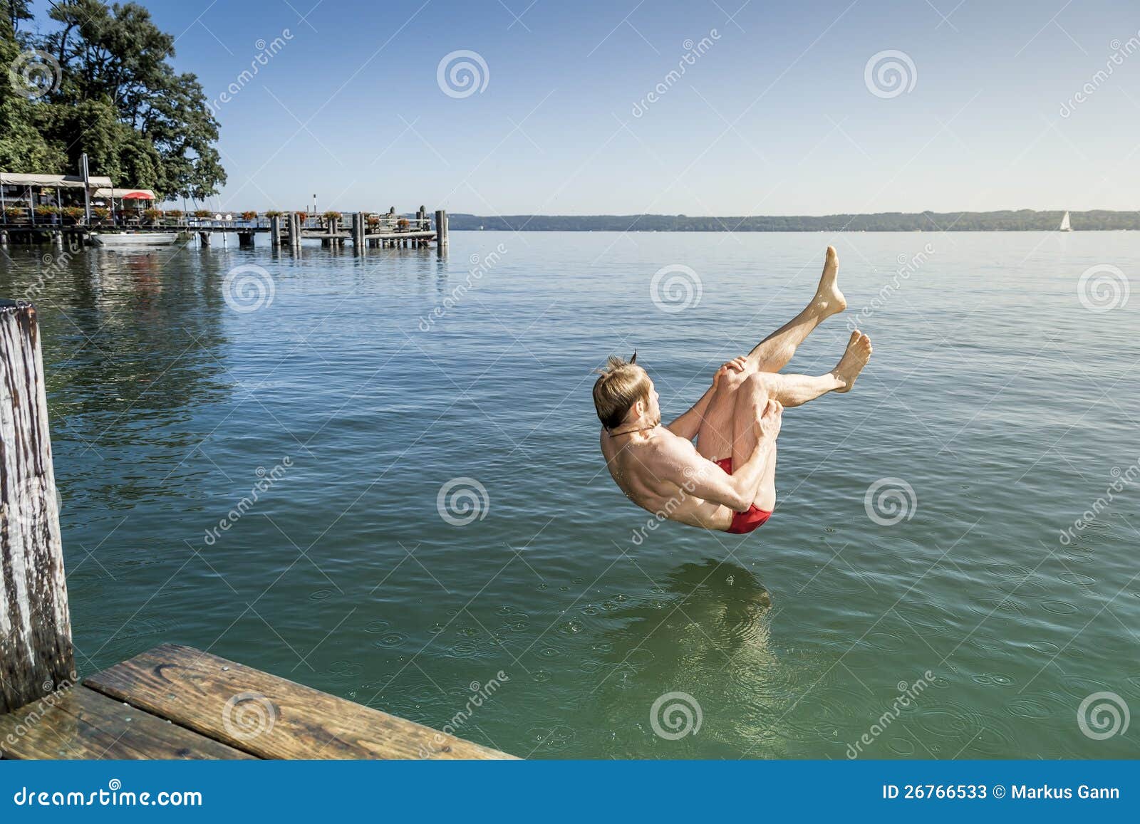 Jumping into the water stock image. Image of activity - 26766533