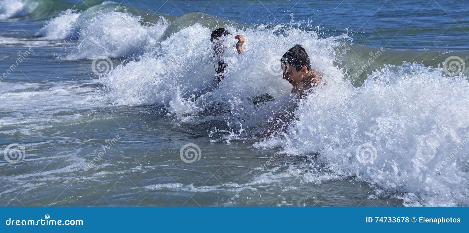 Jumping in the waves stock photo. Image of power, beauty - 74733678