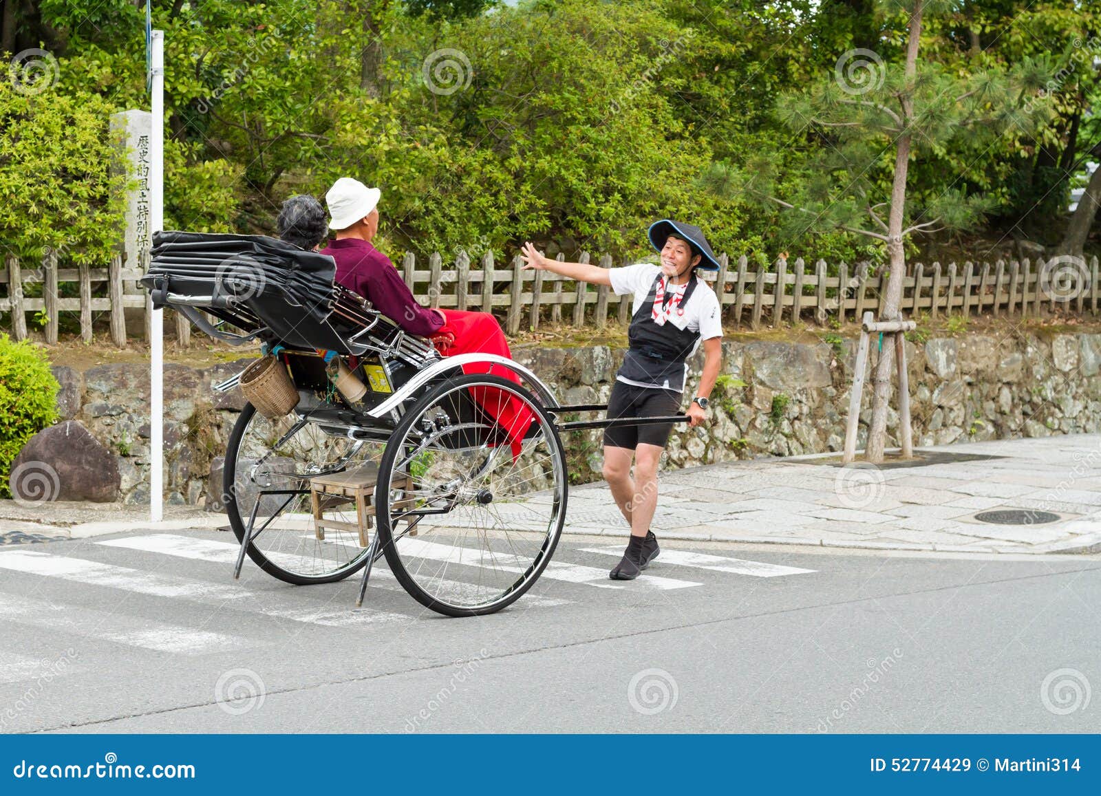June 2012 - Arashiyama, Japan: an Asian Man Pulling a Pulled Rickshaw ...
