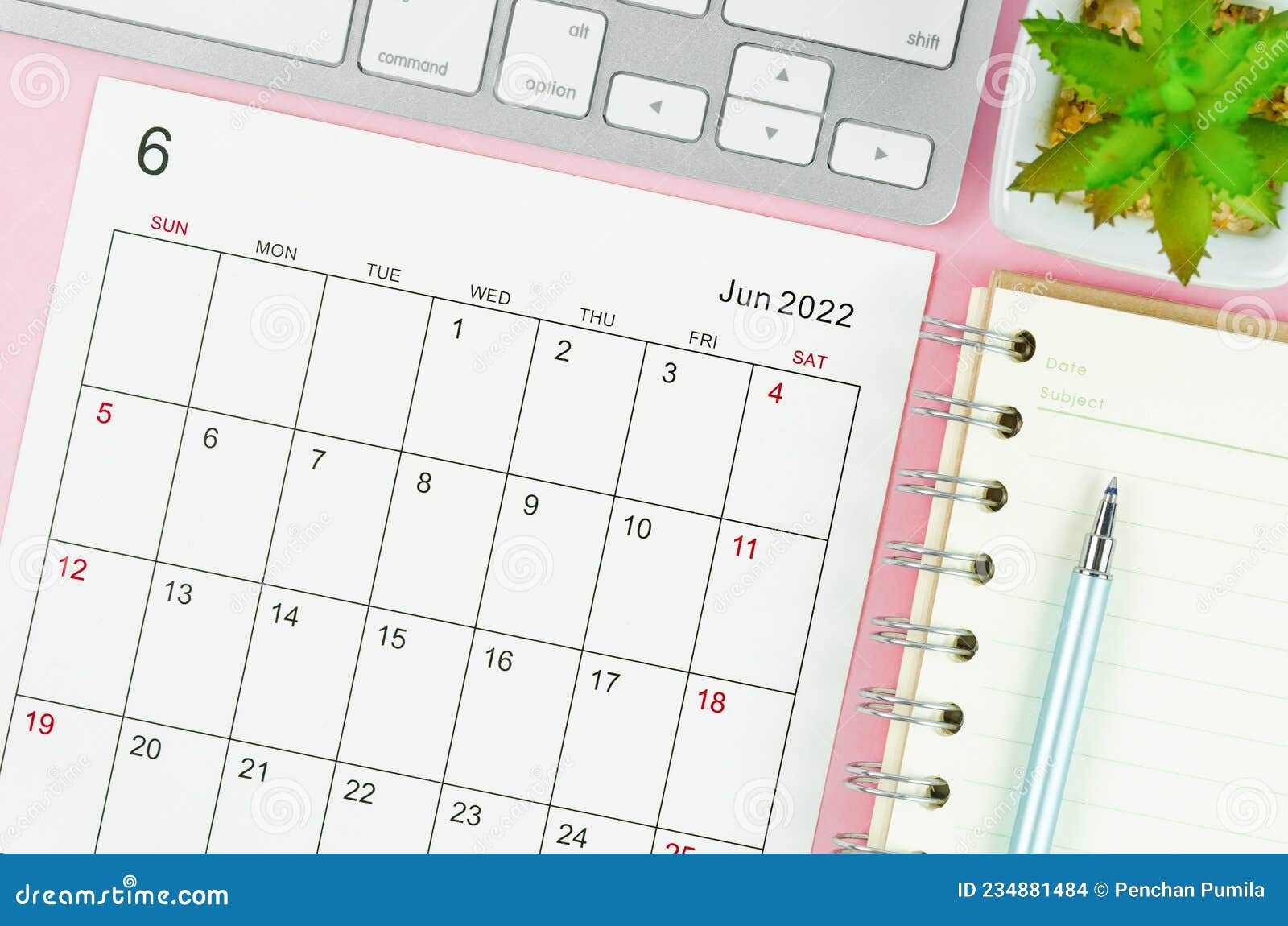 June 2022 Calendar Sheet With Keyboard Computer On Pink Background ...