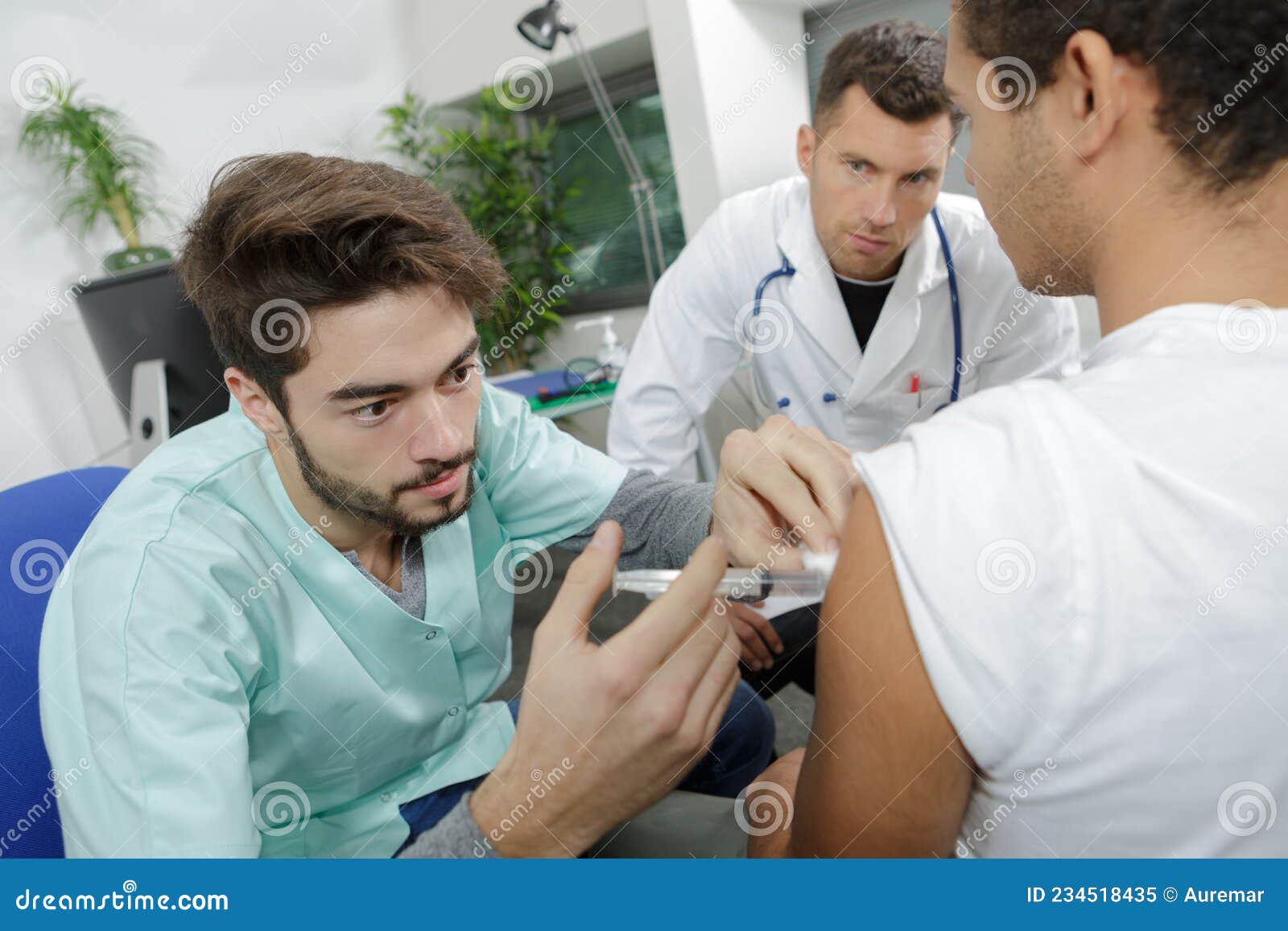 Junior Doctor Being Supervised Administering Injection Stock Image ...