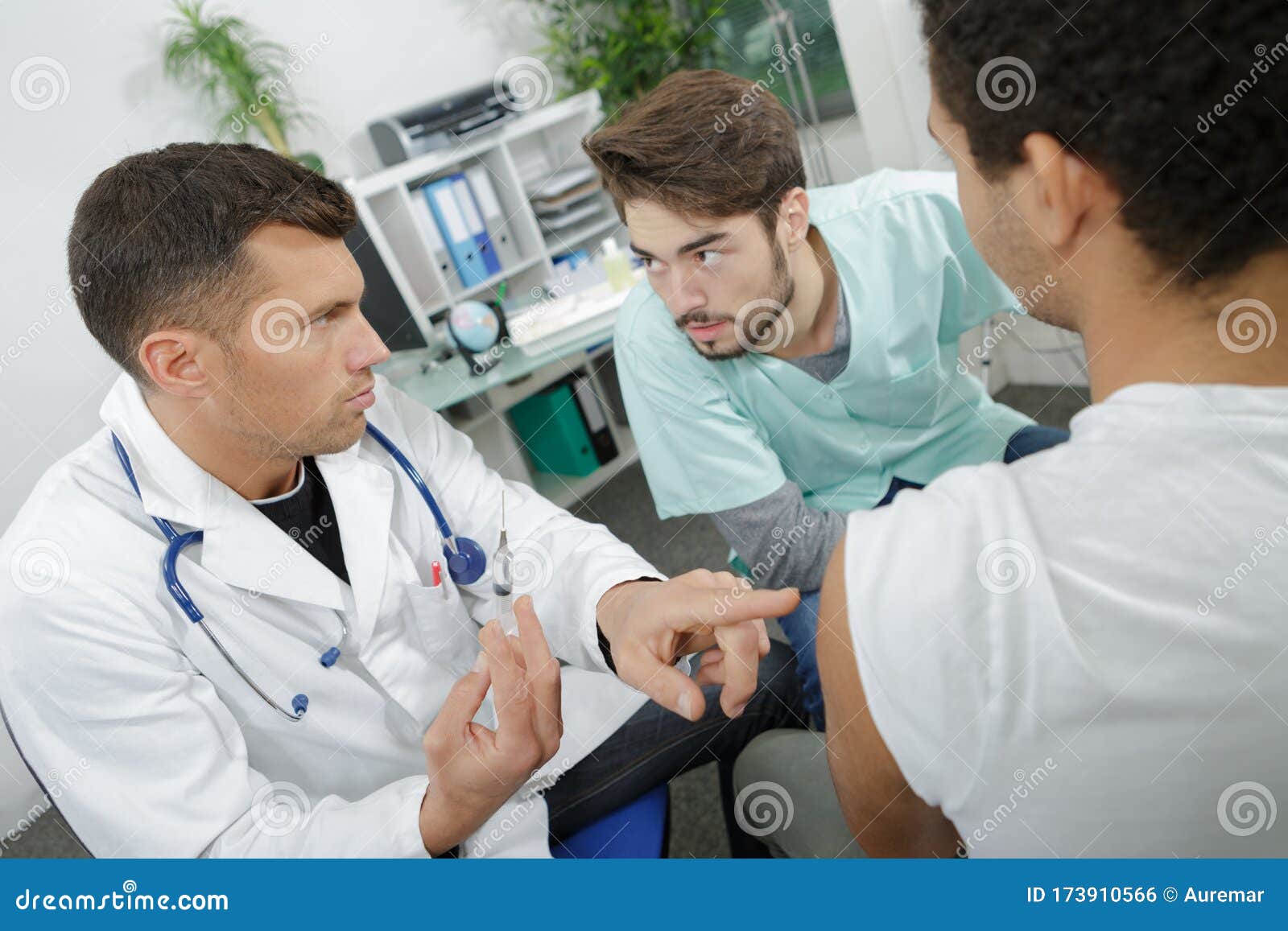 Junior Doctor Learning How To Inject Patient Stock Photo - Image of ...