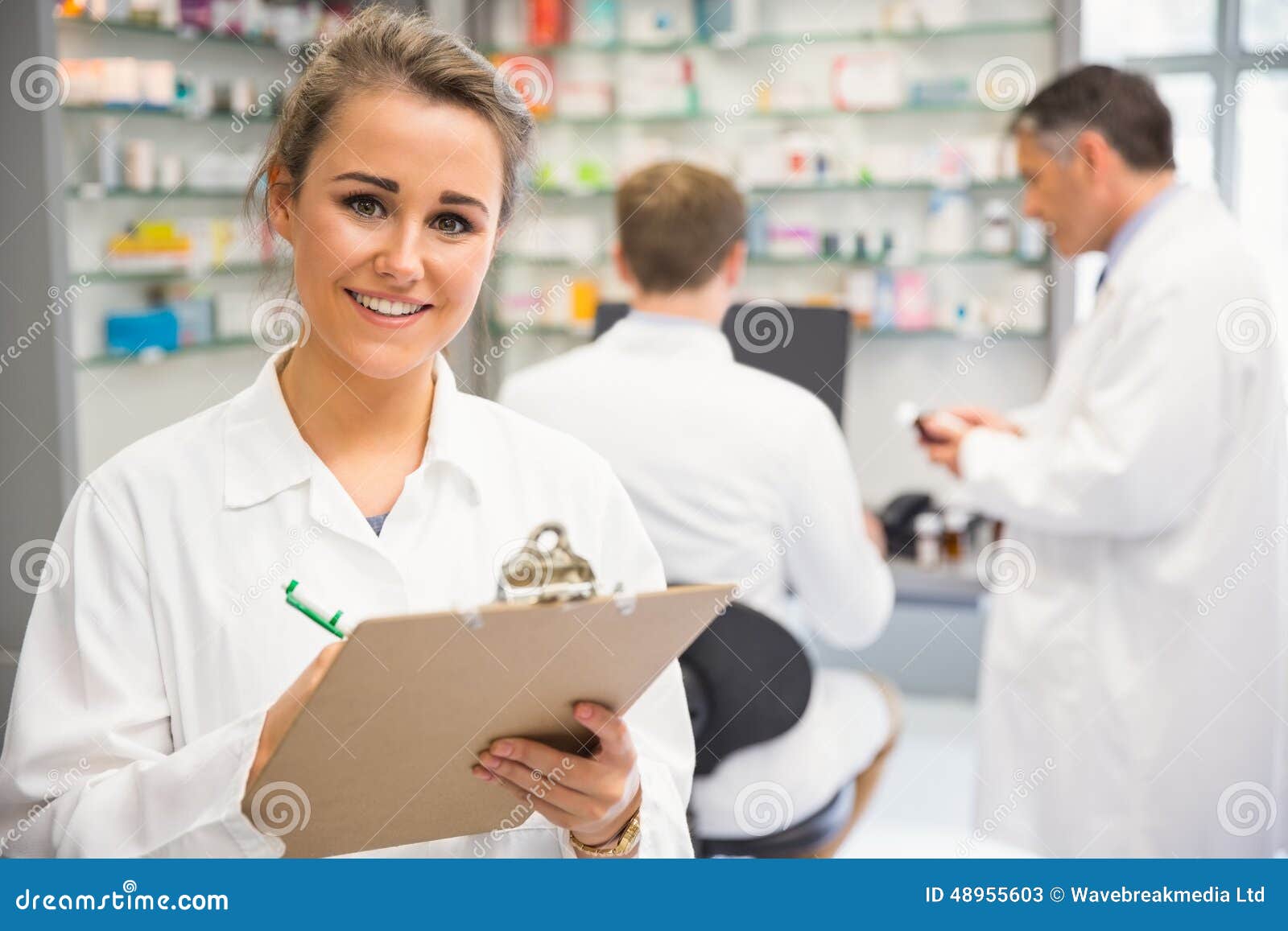 Junior Pharmacist Writing on Clipboard Stock Image - Image of care ...