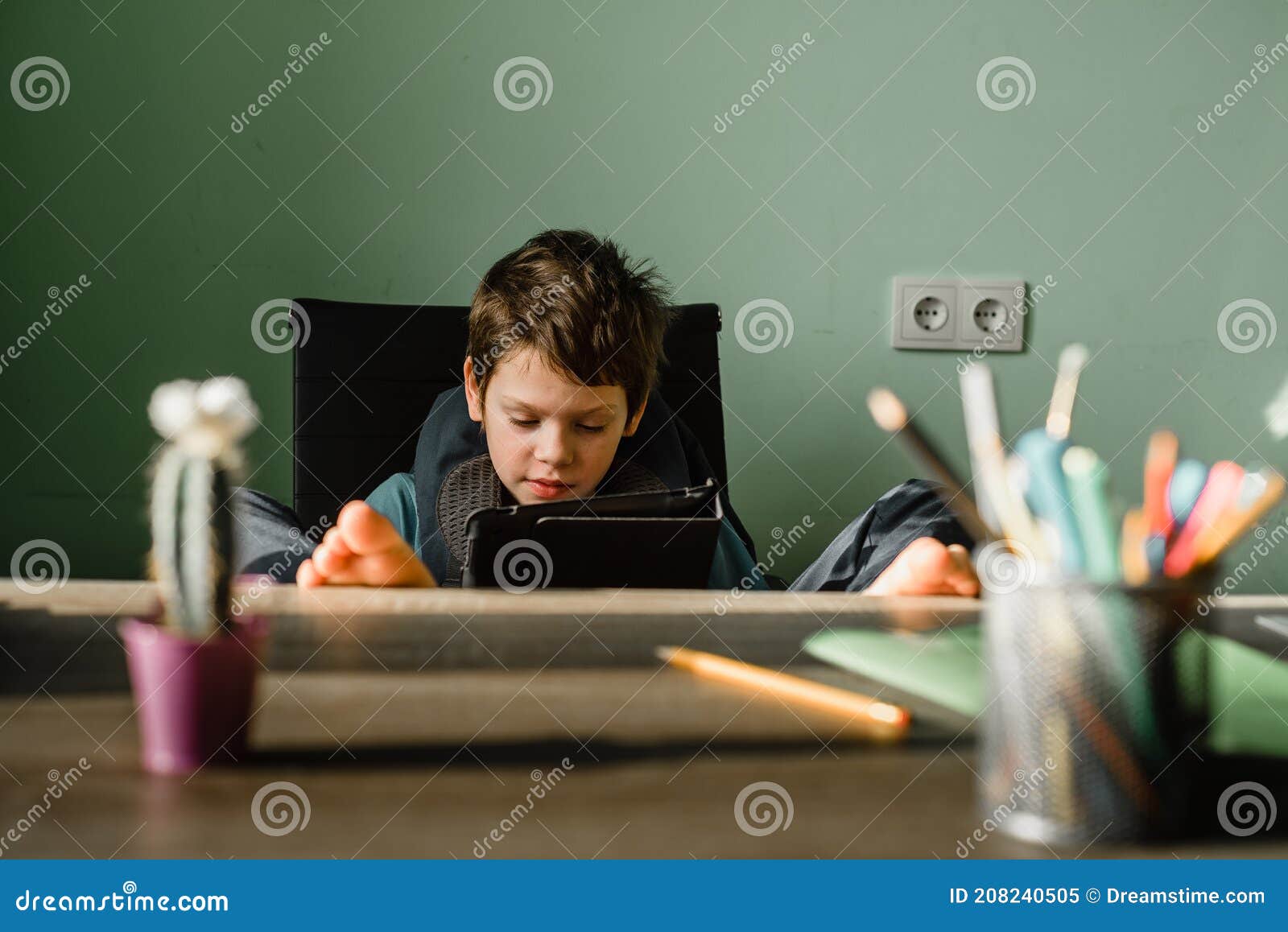 Junior School Boy Using Tablet at Home, Growing Up with Technology ...