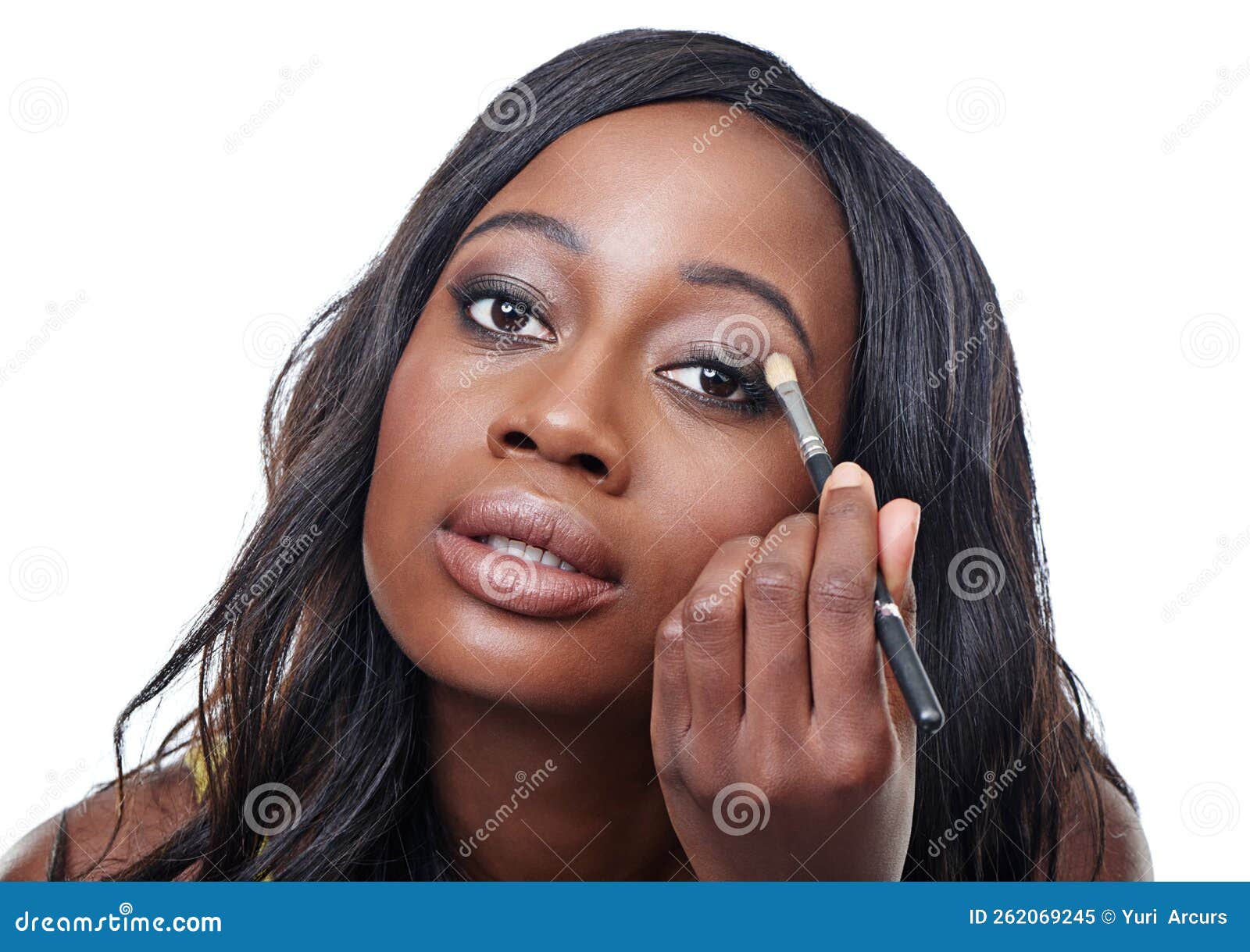 Just Adding a Touch. Studio Shot of a Young Woman Applying Makeup ...