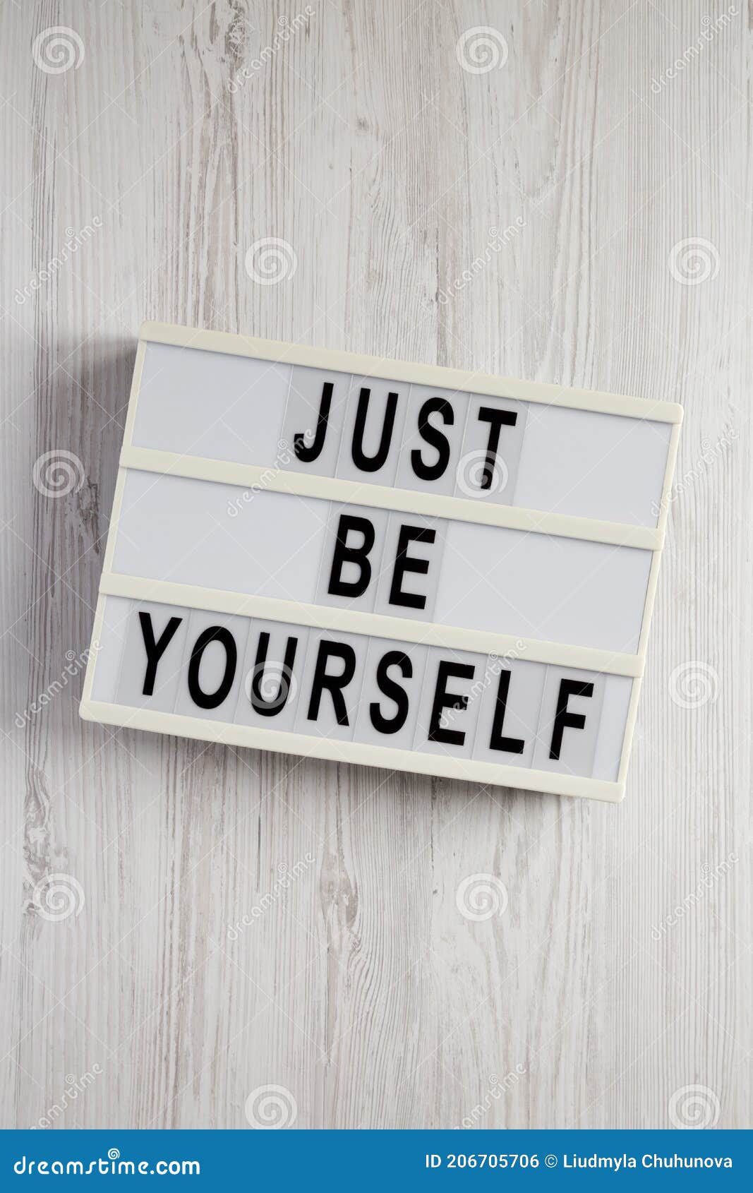 `Just Be Yourself` on a Lightbox on a White Wooden Surface, Top View ...