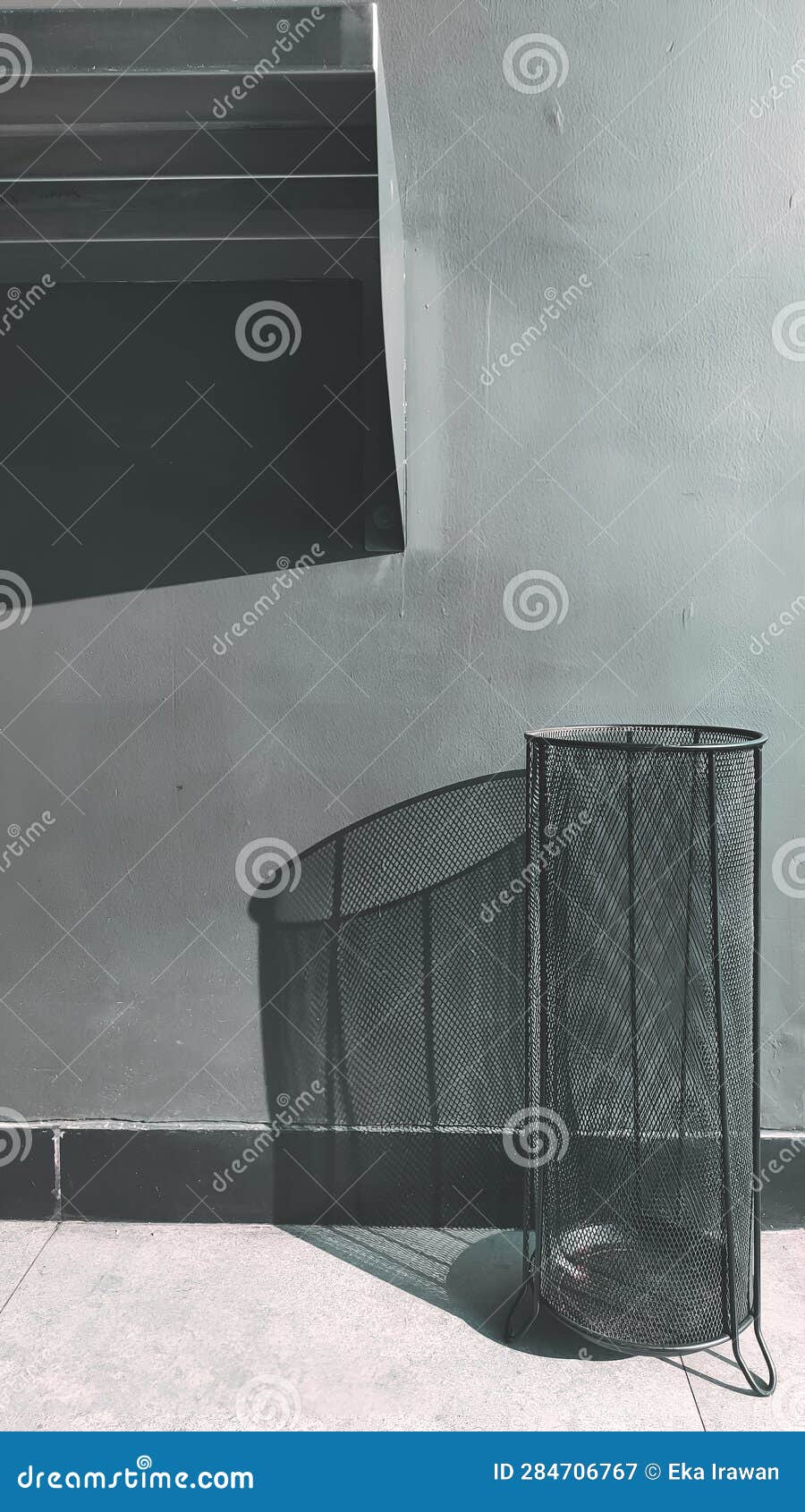 Just Chillin Like a Trash Can on the Side of a Building Stock Image ...