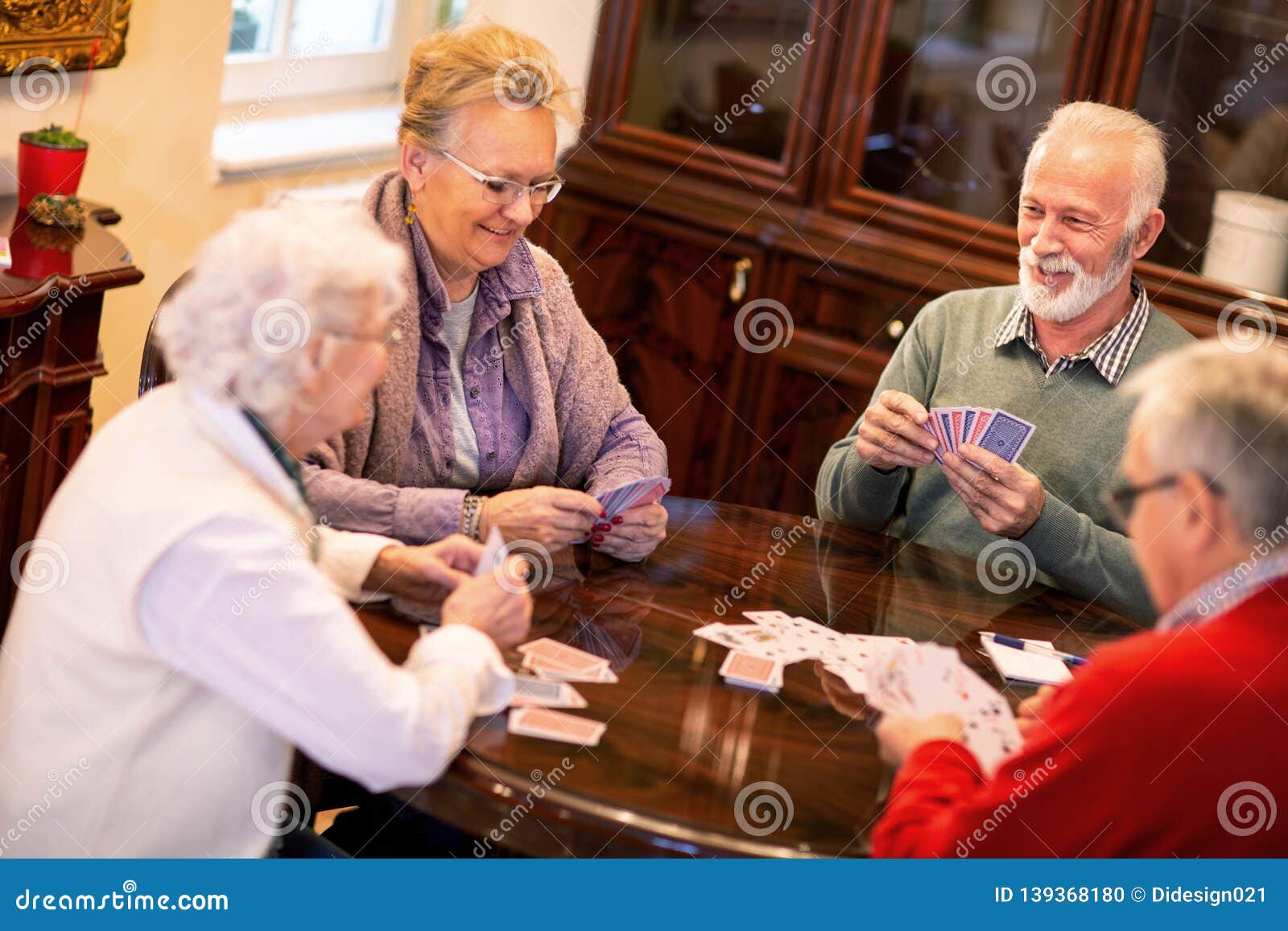 Just a Friendly Card Game between Old Friends Stock Photo - Image of ...