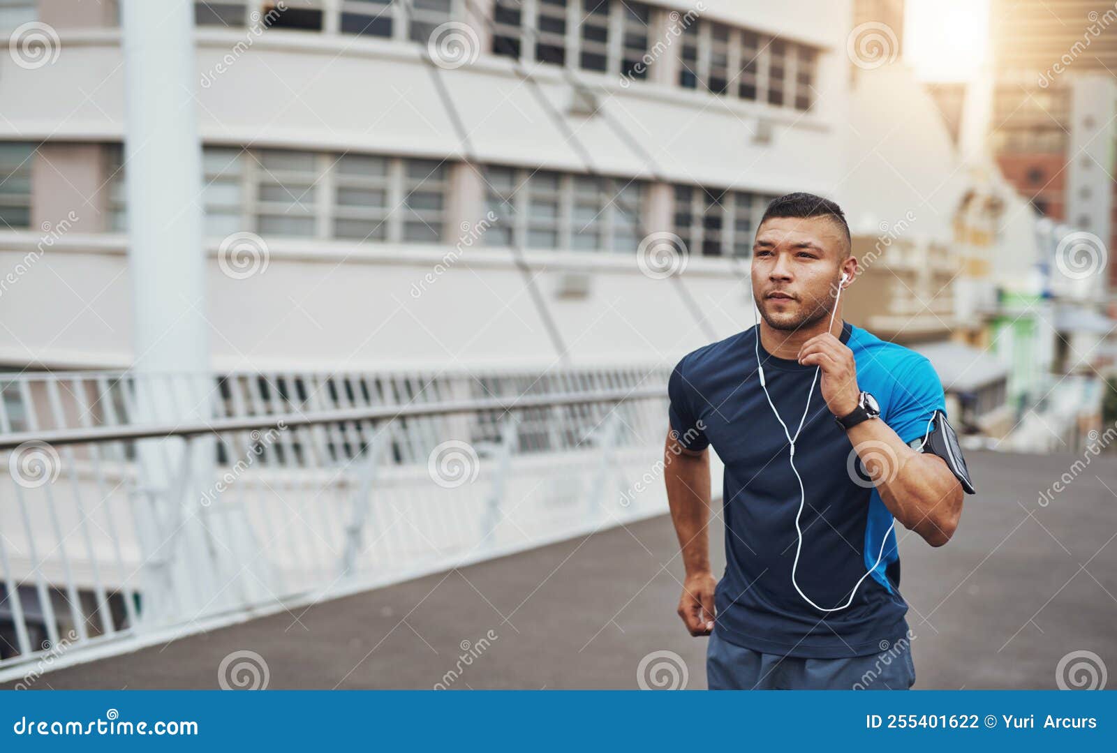 Just Keep Running. a Young Man Out for a Run in the City. Stock Photo ...