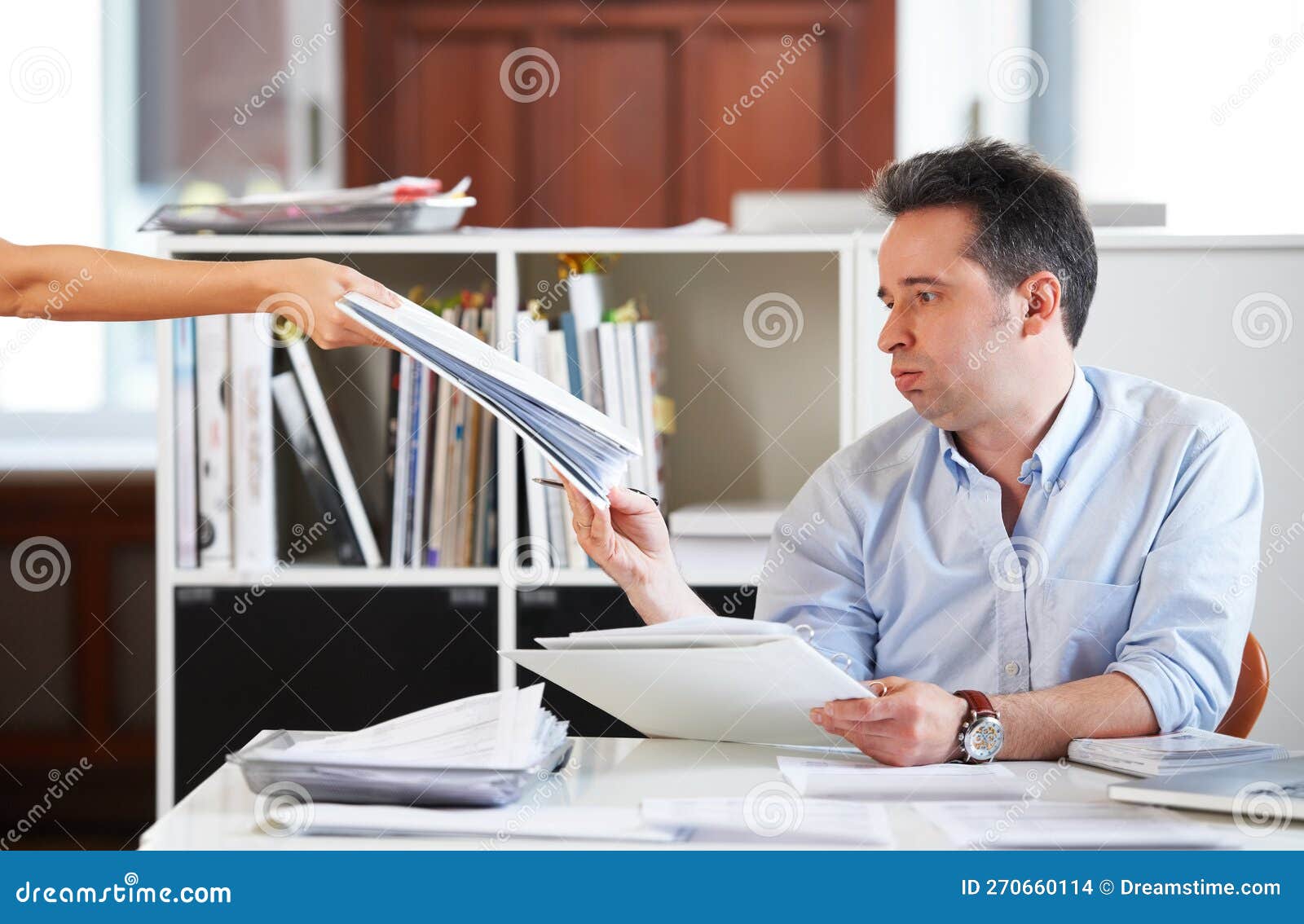 It Just Keeps Piling Up.... Shot of a Mature Office Worker Receiving a ...