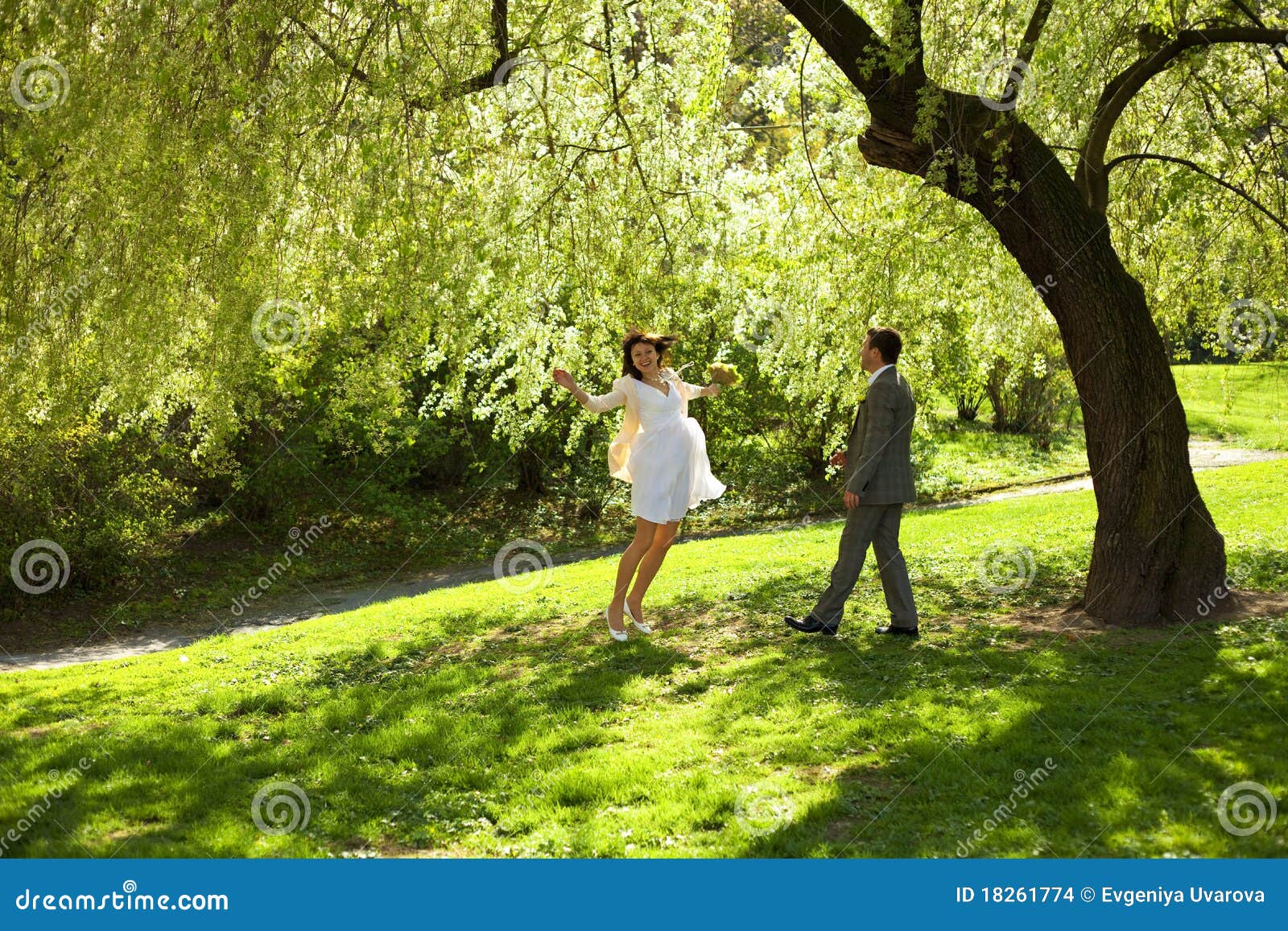 Just Married Standing Under the Tree Stock Photo - Image of outdoors ...