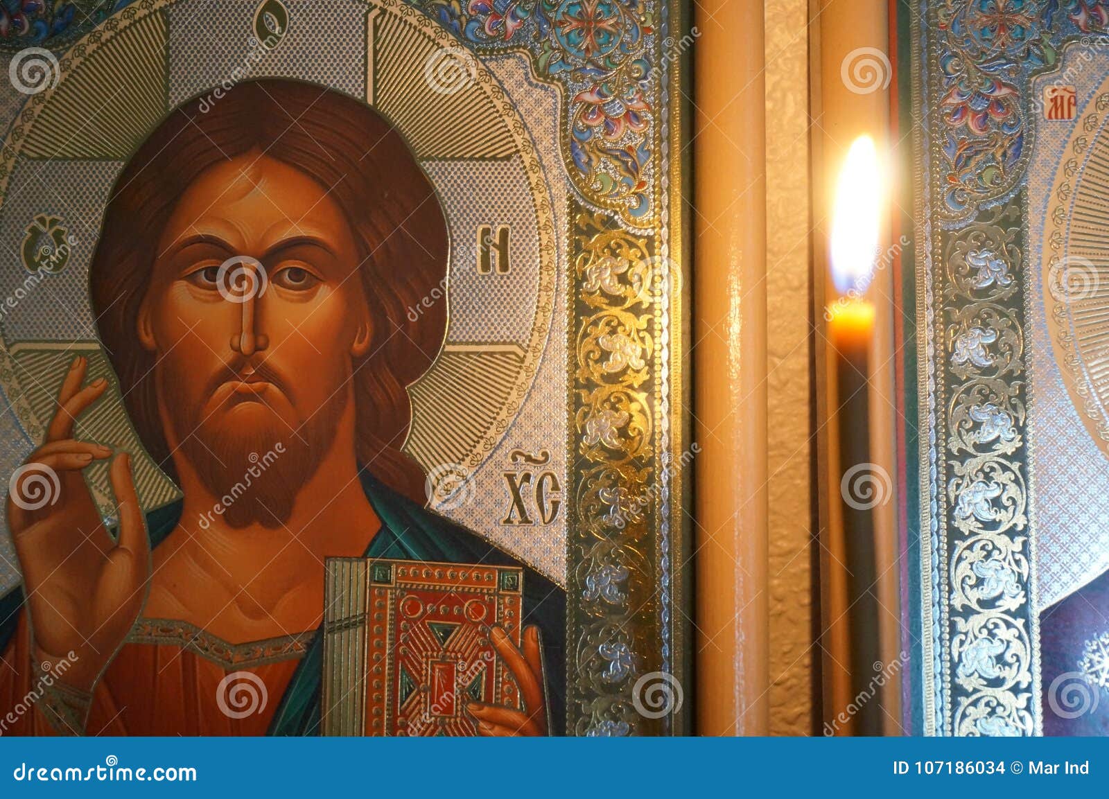 Jusus icon with candle stock photo. Image of orthodox - 107186034