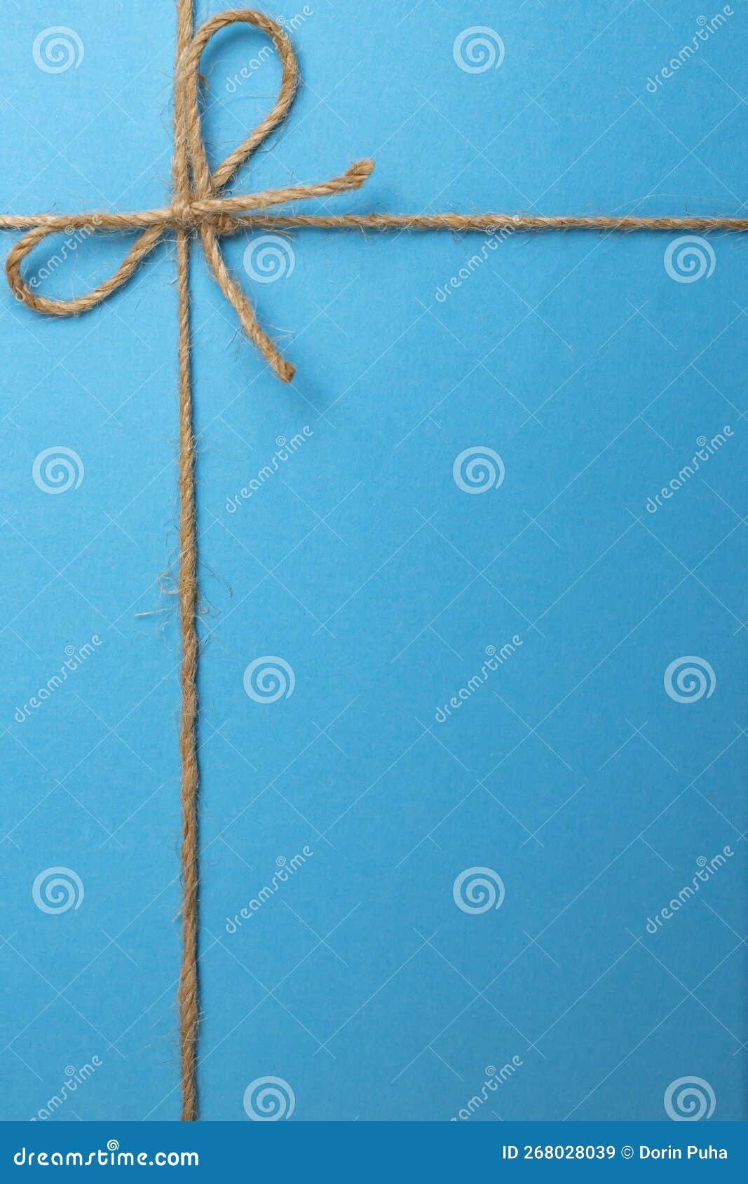 Jute String Bow and Framing Lines on Blue Paper Texture Stock Image ...