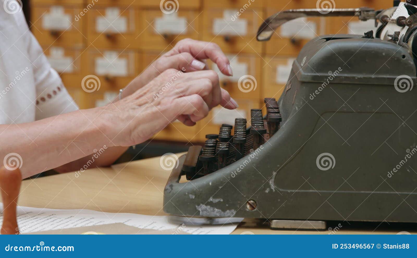 4K. an Elderly Woman Typing on a Typewriter in the Library Stock Video ...