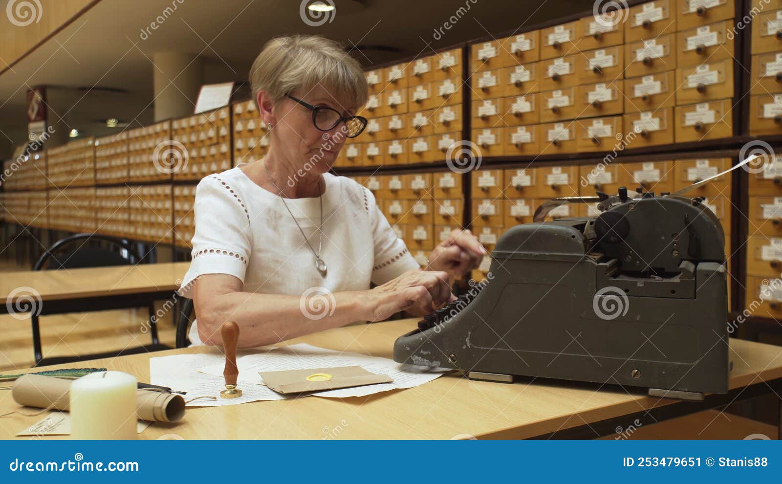 4K. an Elderly Woman Typing on a Typewriter in the Library Stock Video ...
