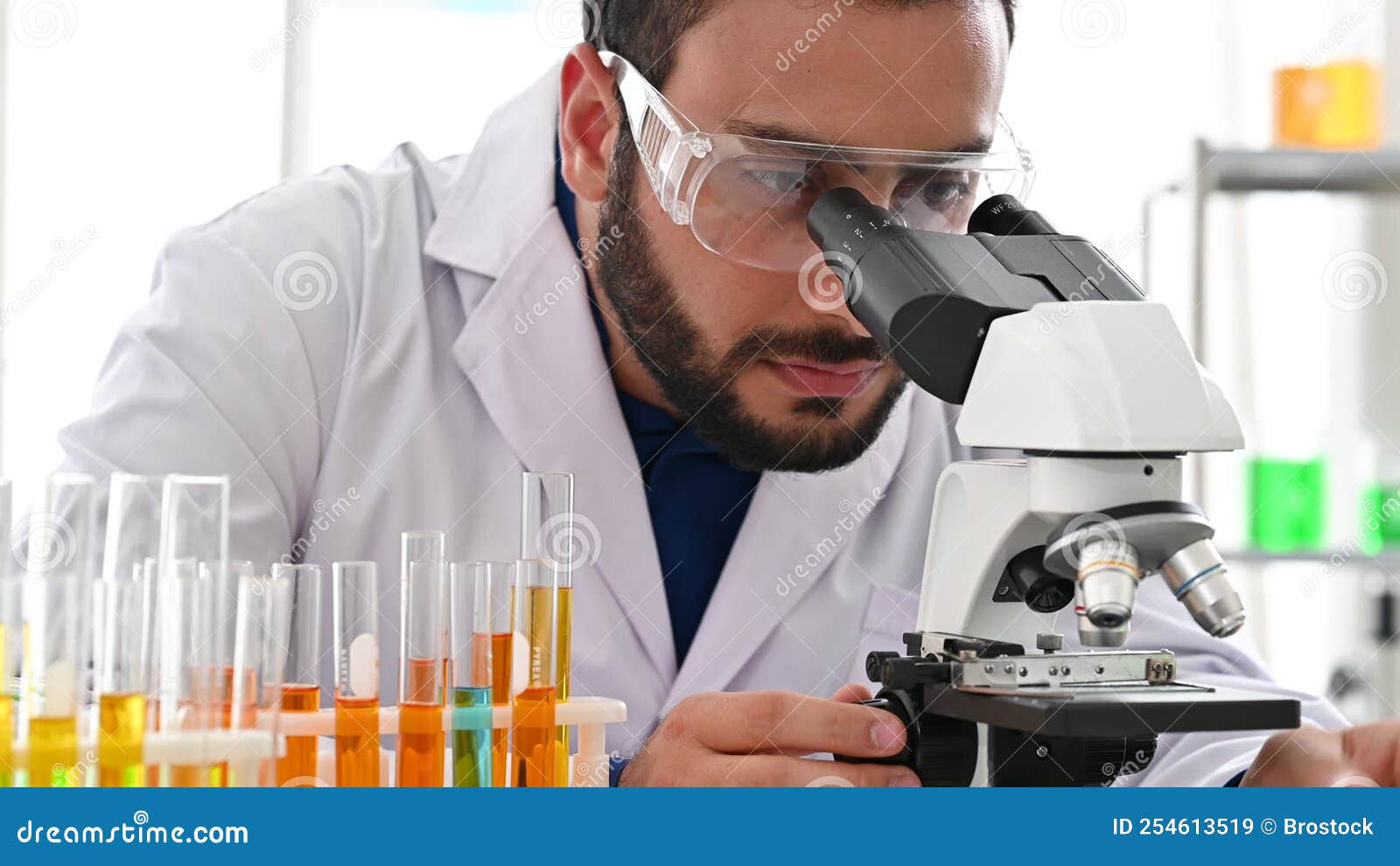 4K Portrait of Scientist Looking in Microscope while Working on Oil ...
