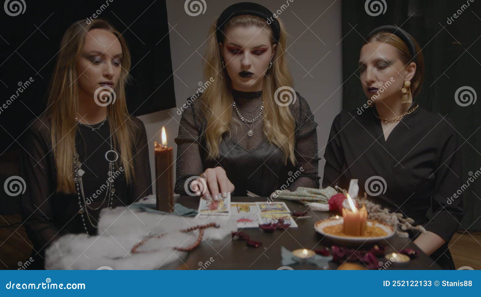Two Female Witches Hold Pumpkins In Their Hands, Covering Their Faces ...