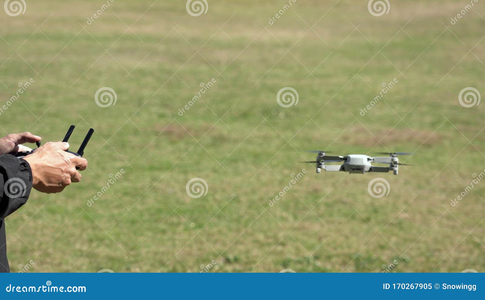 4k Video of Man Pilot Operating a Drone with Remote Control ...
