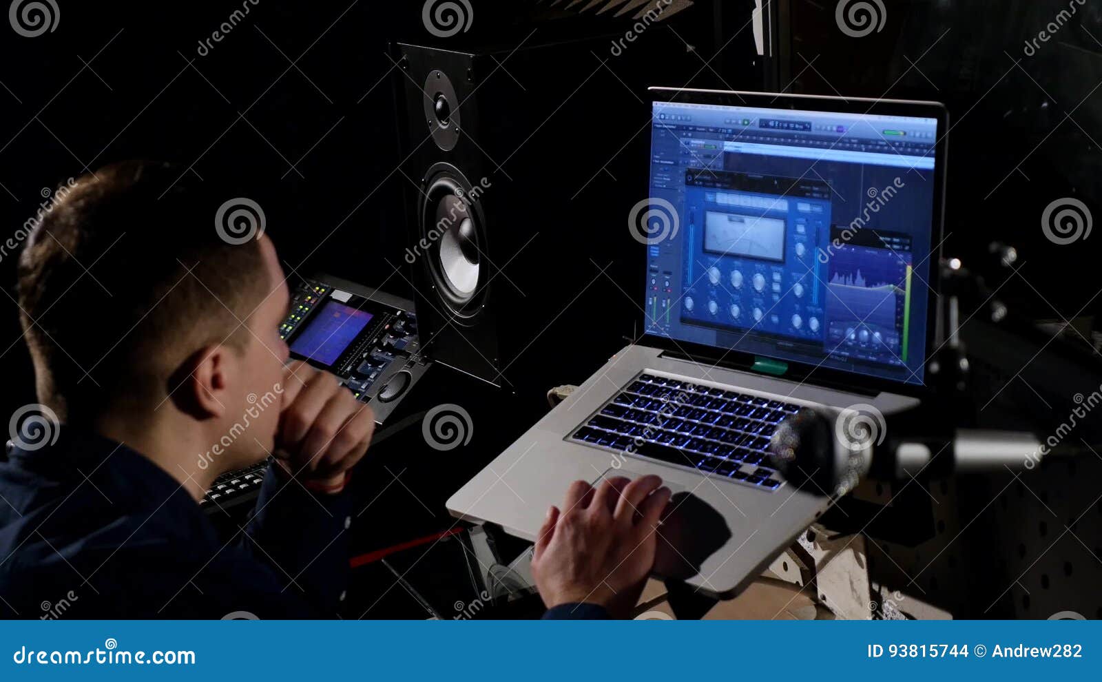 4K Young Sound Engineer in Recording Studio Using Laptop at the Mixing ...