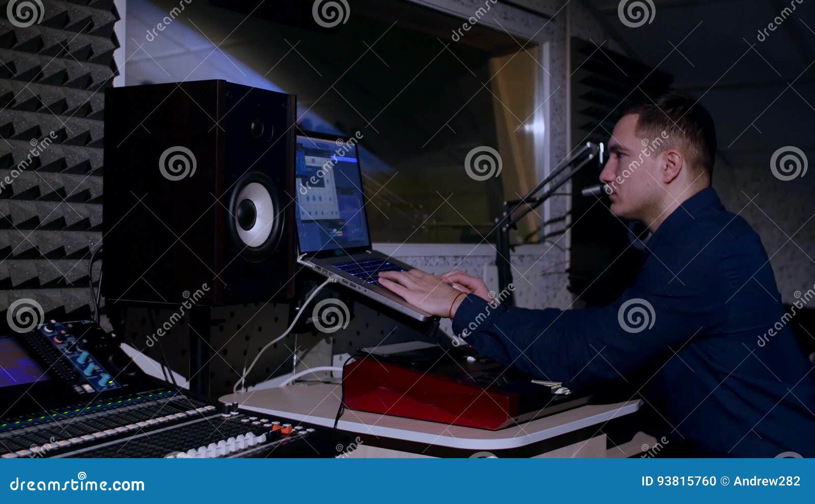 4K Young Sound Engineer in Recording Studio Using Laptop at the Mixing ...
