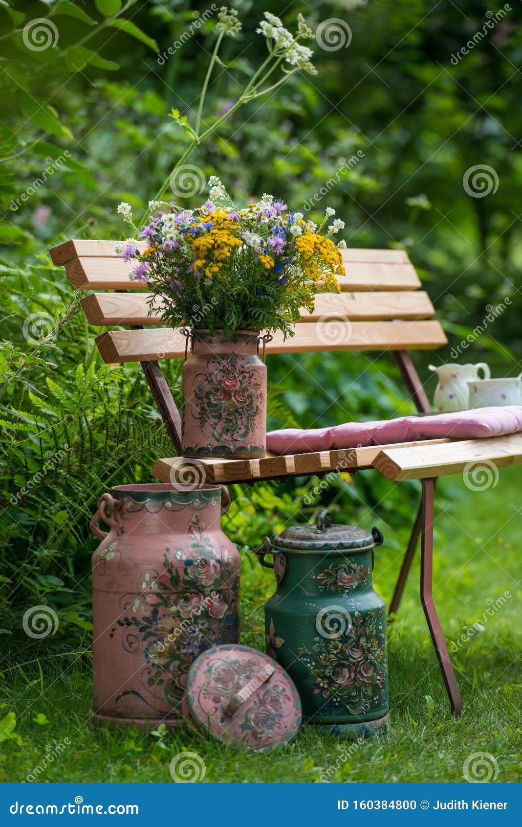 Old Painted Milk Jugs on a Garden Bench Stock Photo - Image of ...