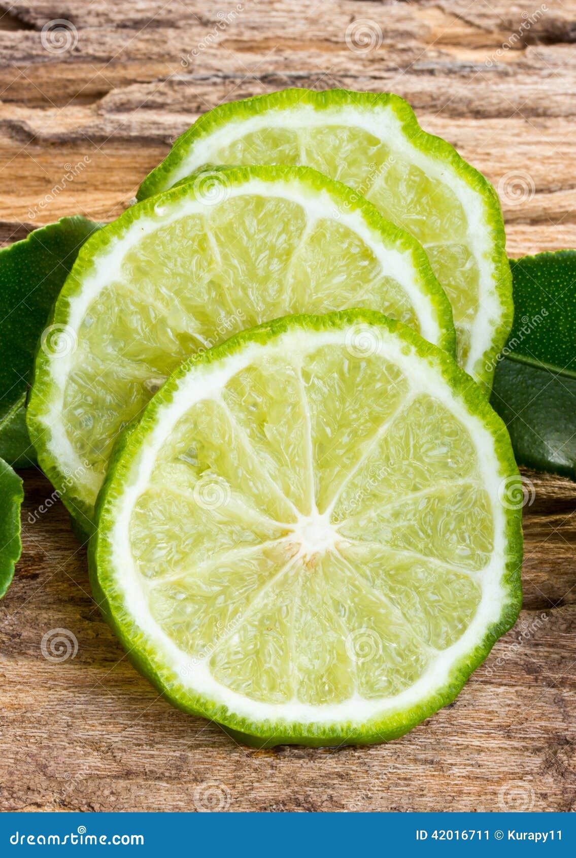 Kaffir limes on wood stock image. Image of sour, lemon - 42016711