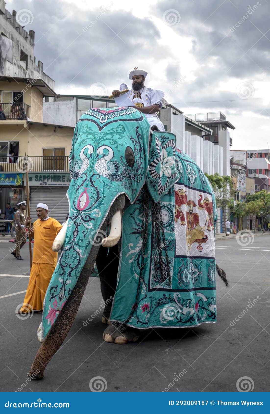 The Front Runner Mounted on a Tusker Elephant Reads the Religious ...