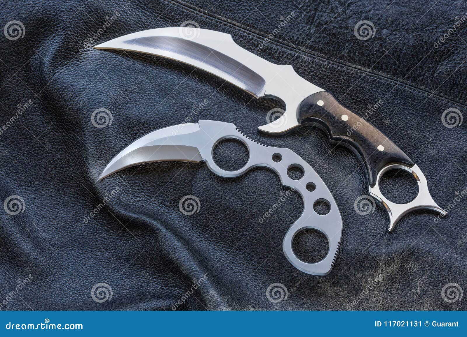 Karambit Knives Designer Made, on a Worn Leather Black Jacket Stock ...