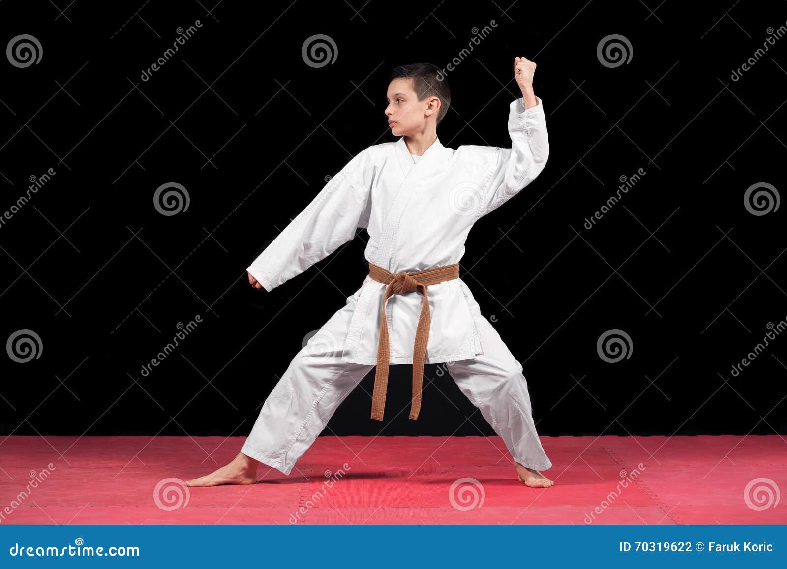 Karate Boy In White Kimono Fighting Isolated On Black Background Stock ...