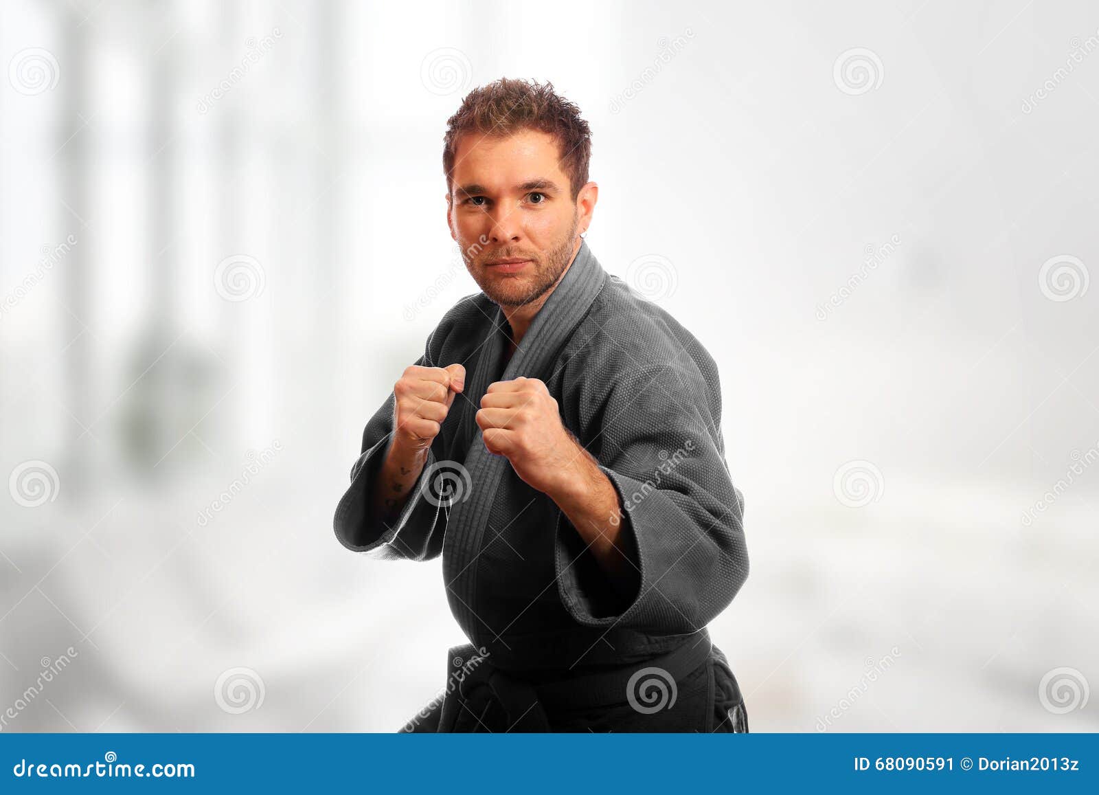 Karate man in a kimono stock image. Image of fighter - 68090591