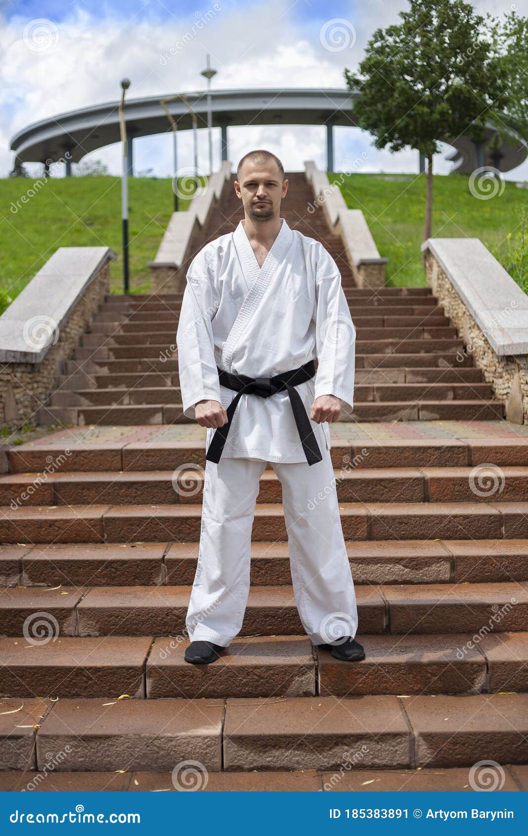 There are Long Steps Behind the Karate. a Karate Trainer Stands and ...
