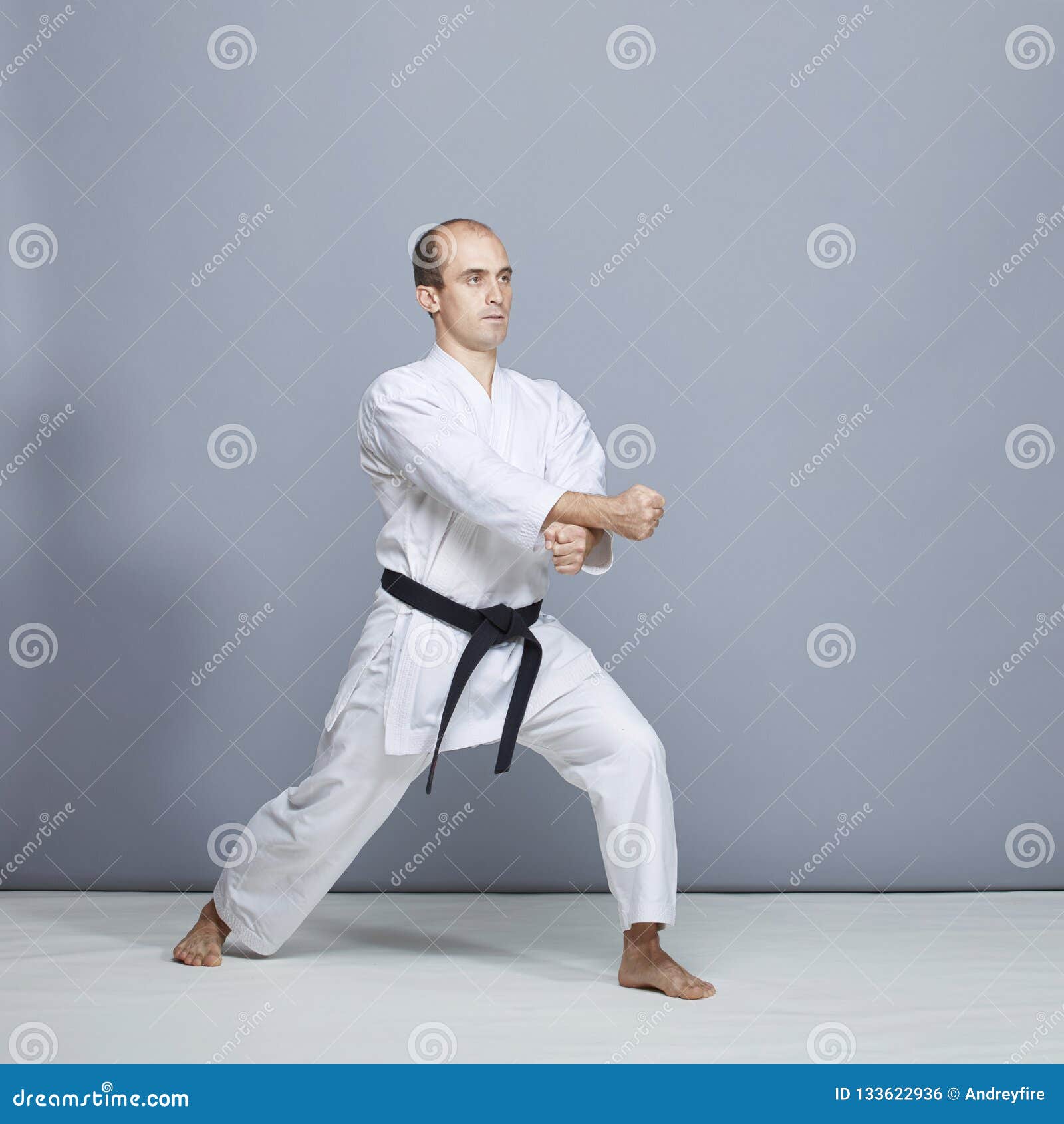 In a Karate Stand, Athlete Train Formal Karate Exercises Stock Photo ...