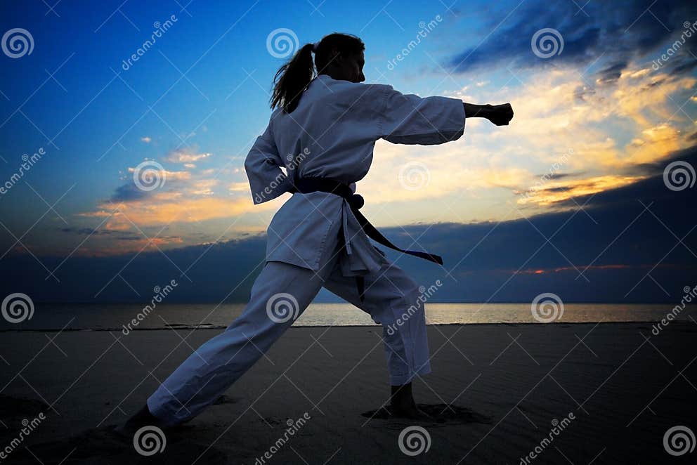 Karate on sunset beach stock image. Image of black, human - 25404367