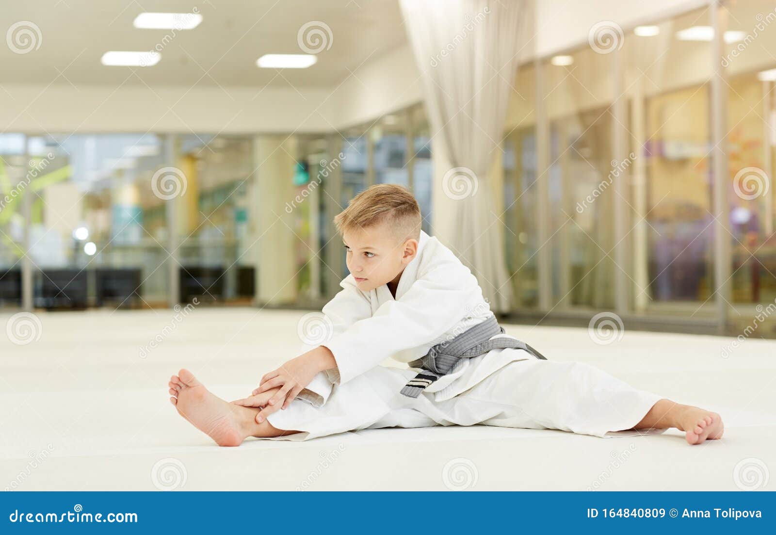 Karateka Stretching on the Floor Stock Image - Image of action, boys ...