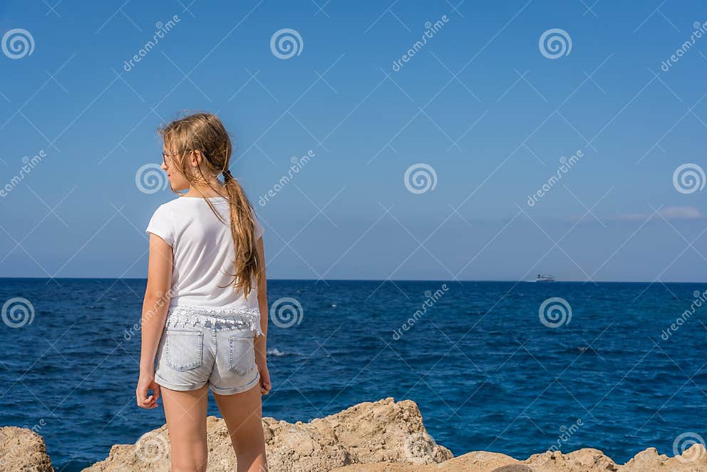 A Girl Standing on the Coast of an Ocean Stock Image - Image of nature ...
