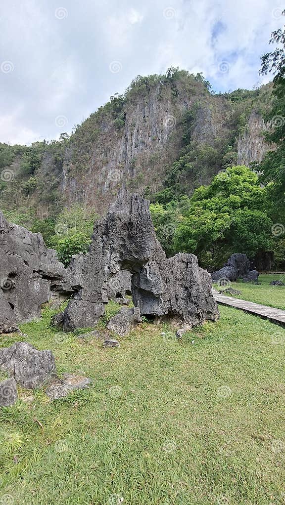 Karst Tower Behind the Hill Stock Photo - Image of rock, building ...
