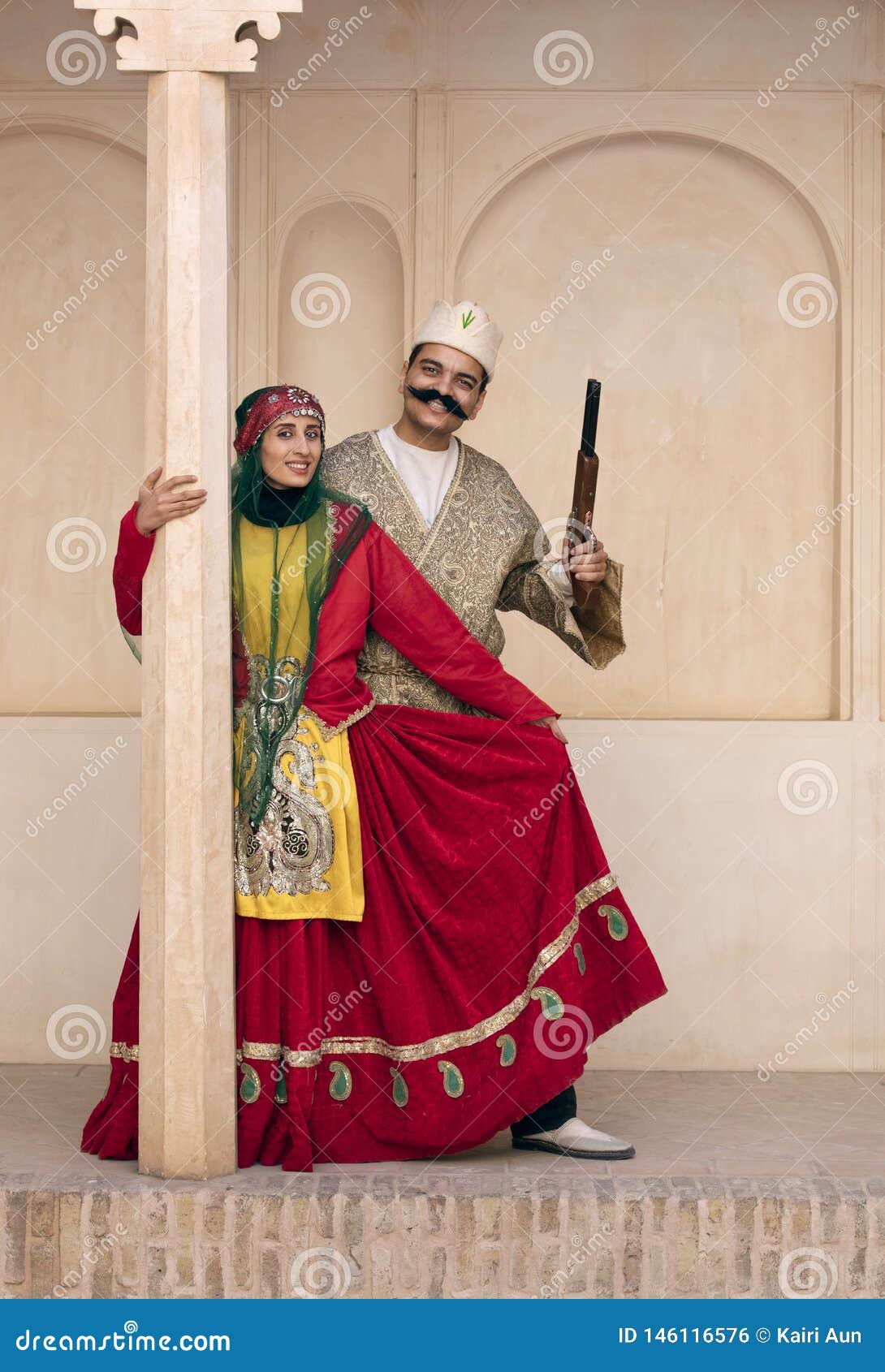 A Pair Of Iranian Couple Holding Hands And Walking In The Street Of