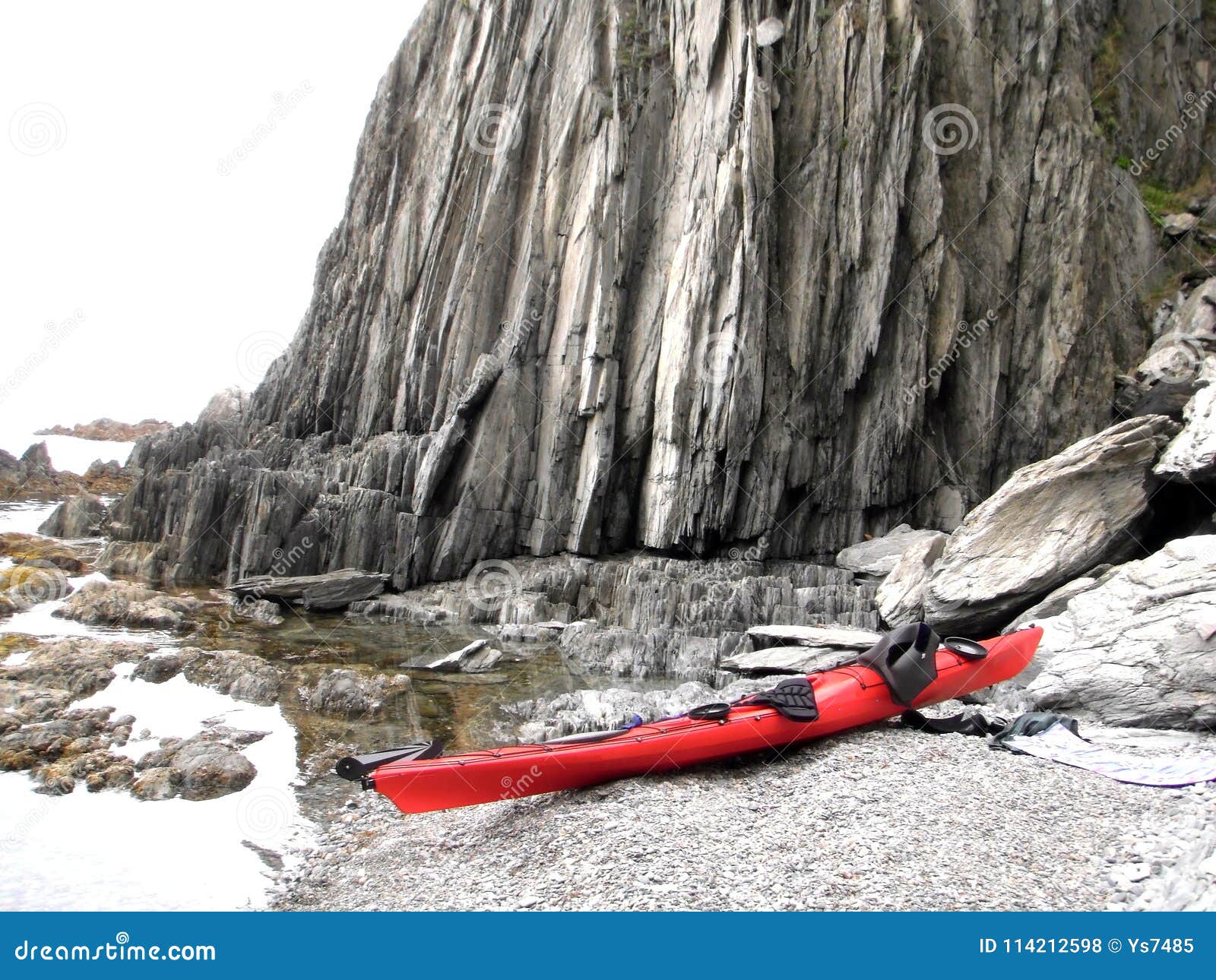 Kayak and Gear in the Rocks on the Sea Beach Stock Photo - Image of ...