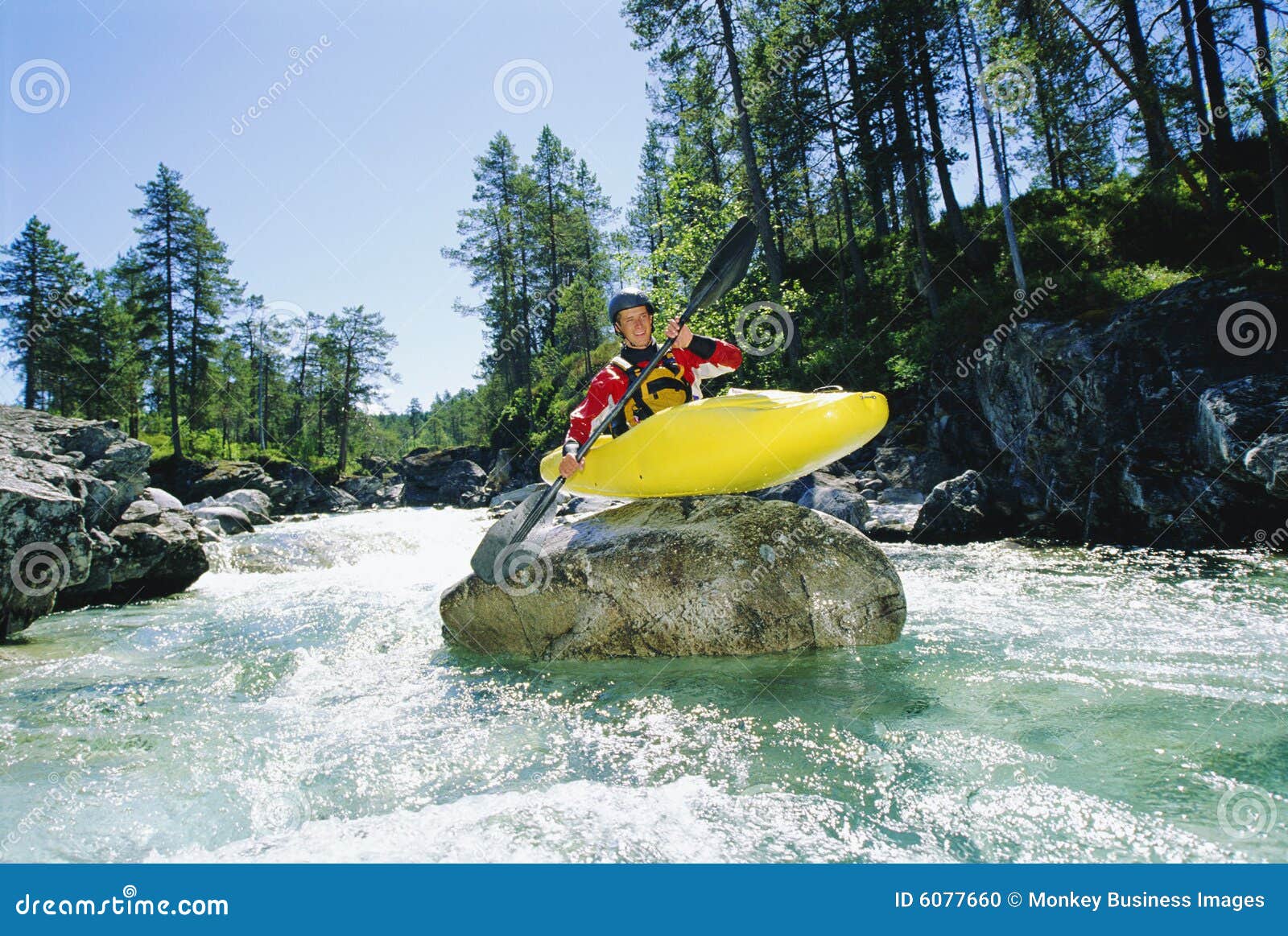 Kayaker Perched on Boulder in River Stock Photo - Image of kayak, tree ...