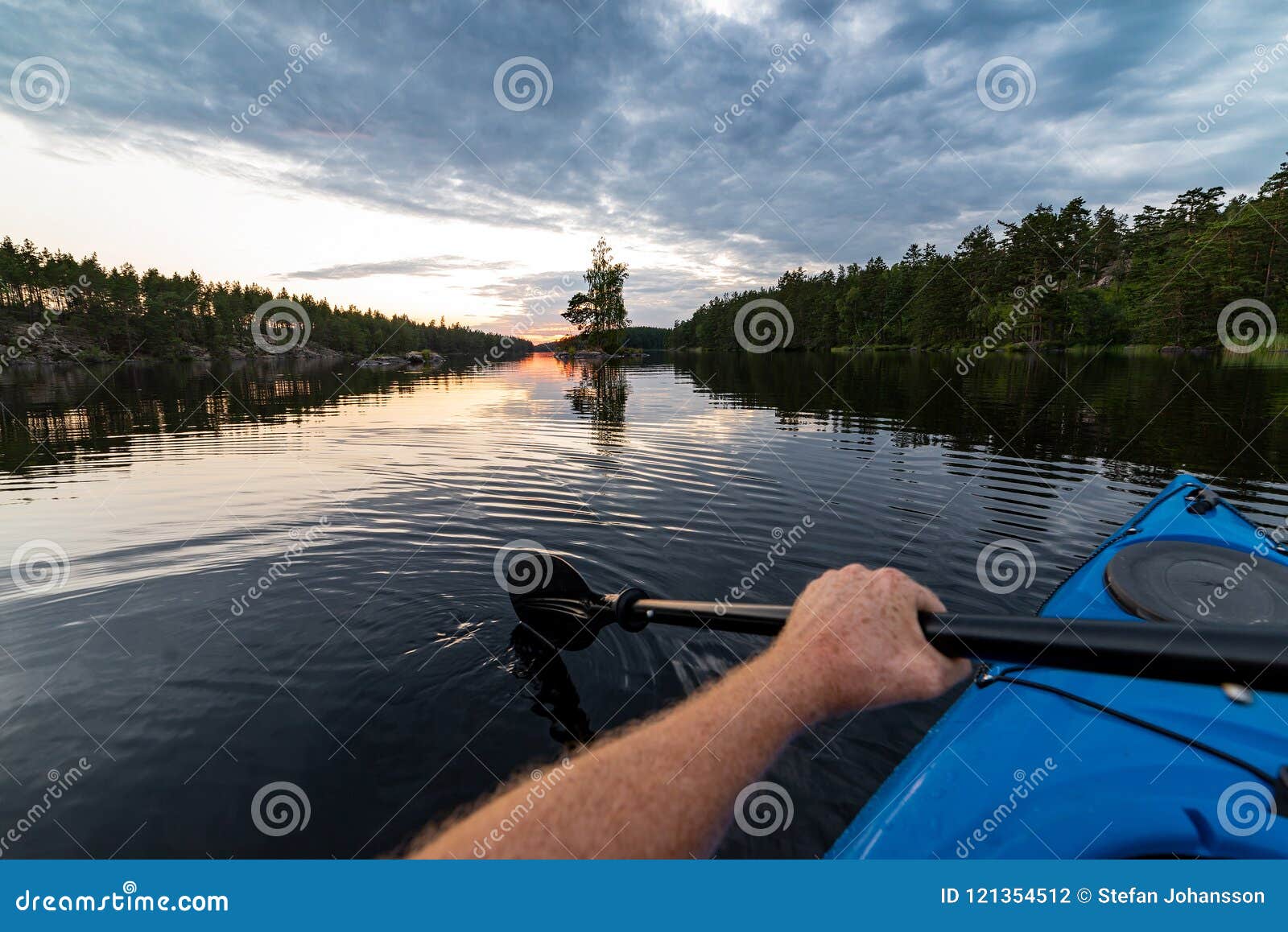 Kayaking in sunset stock photo. Image of recreational - 121354512