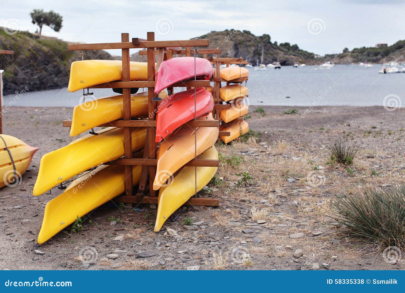 Kayaks Stacked on the Beach Stock Photo - Image of colorful, canoe ...